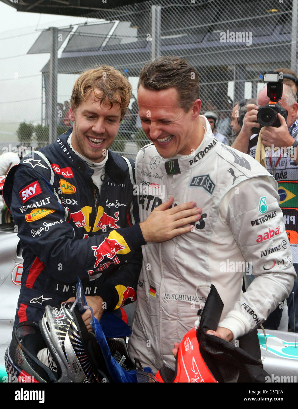 German Formula One driver Sebastian Vettel of Red Bull (L) celebrates ...