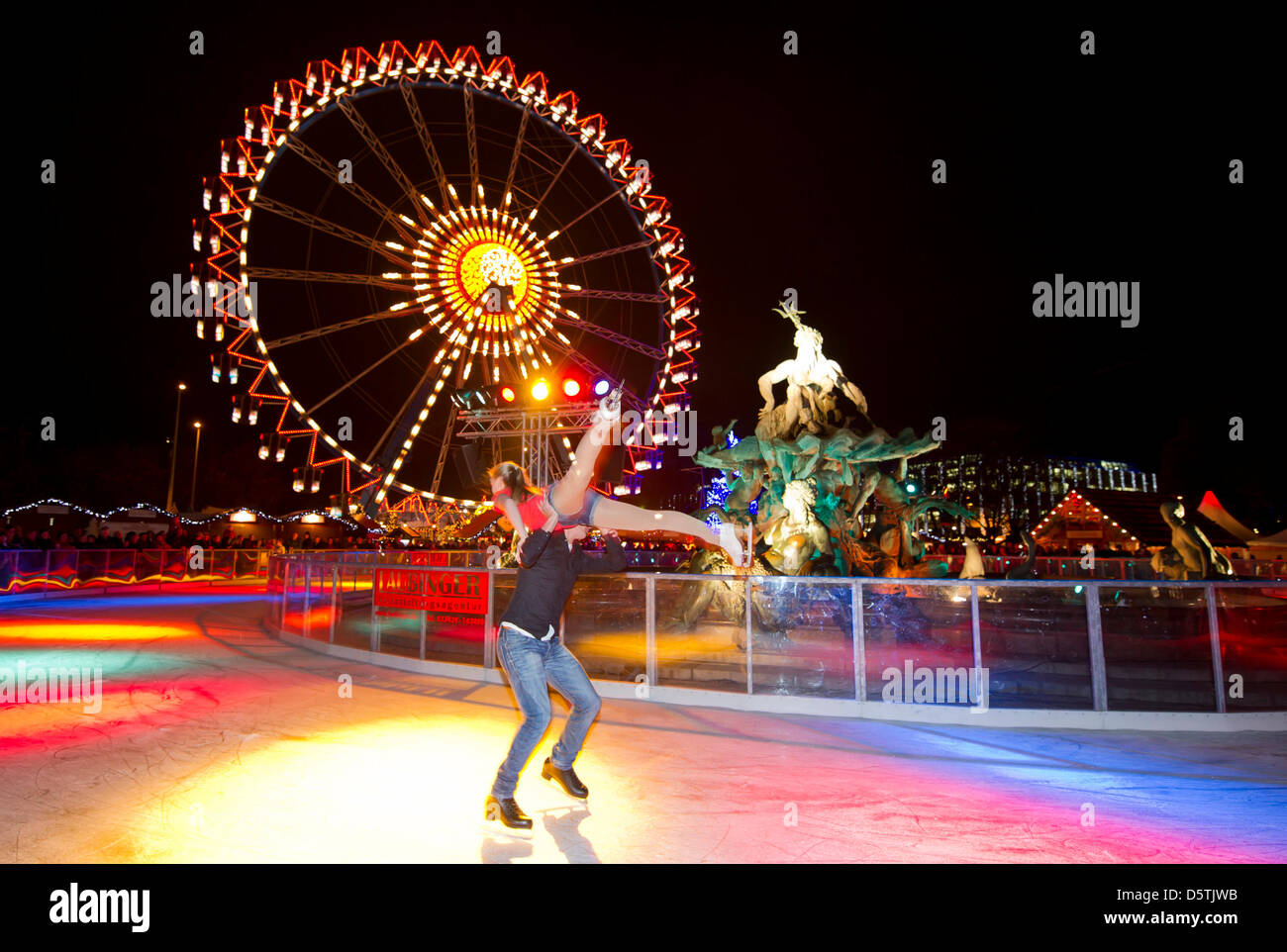 Ice skaters pose on the rink after a small show for the opening of the ...