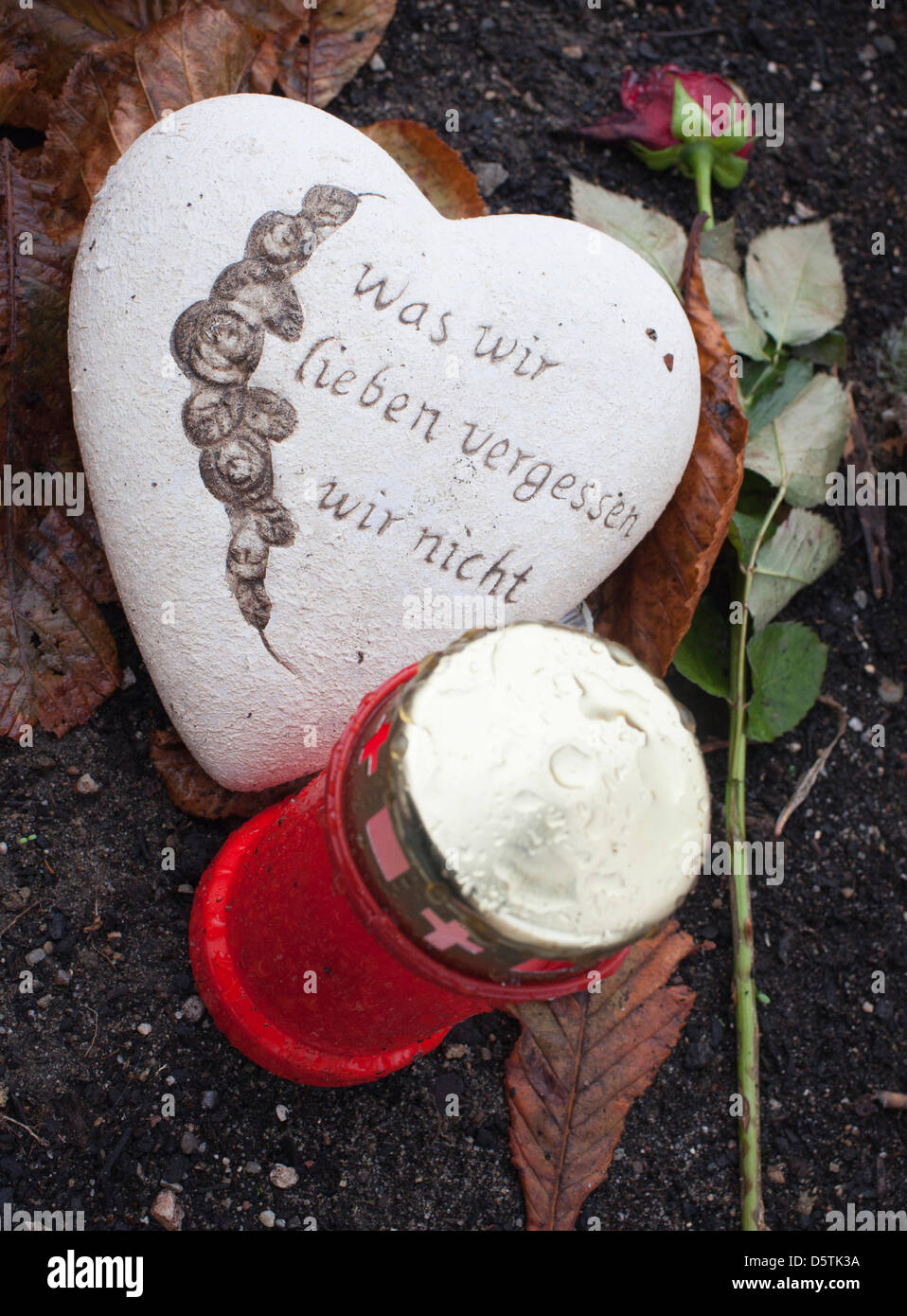 A heart of stone which reads 'We don't forget what we love' sits on the ...