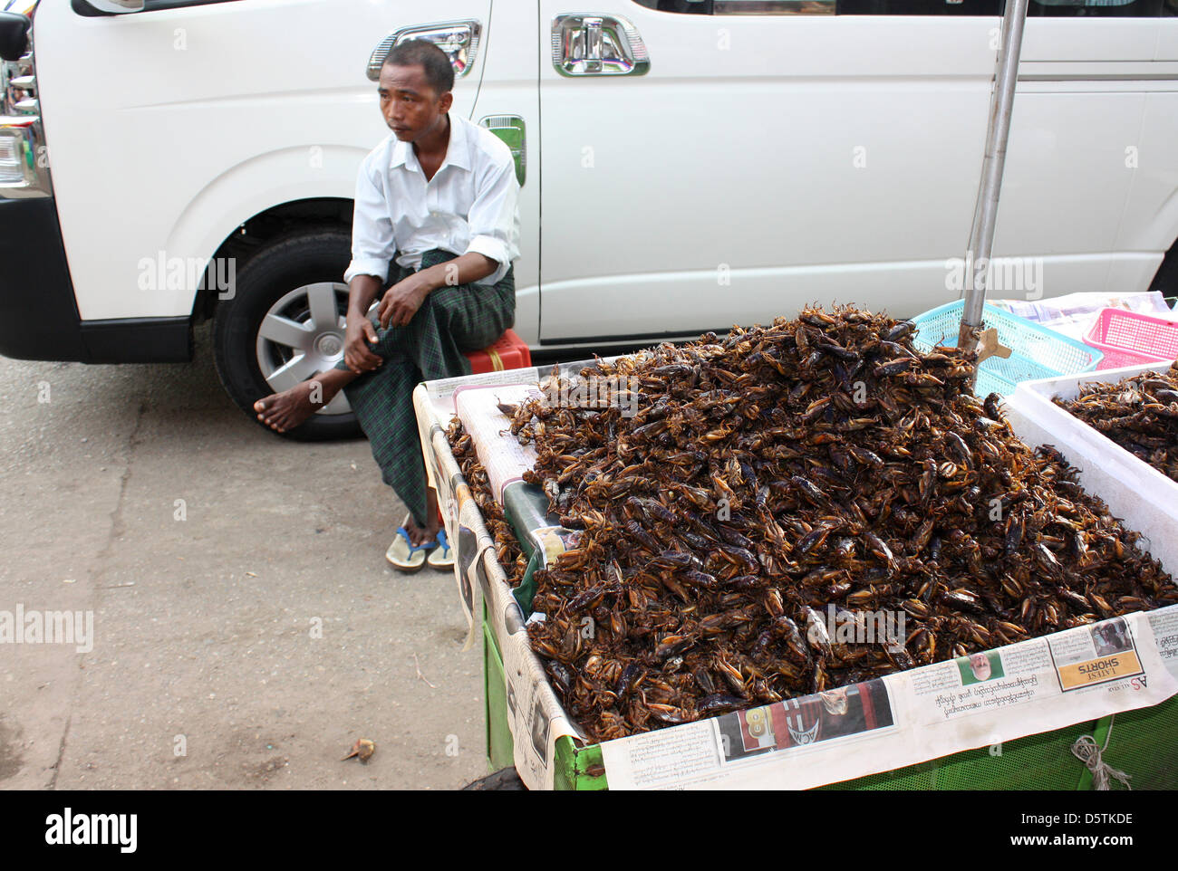 A street vendor sells grille insects in Yangon, Myanmar, 20 October ...