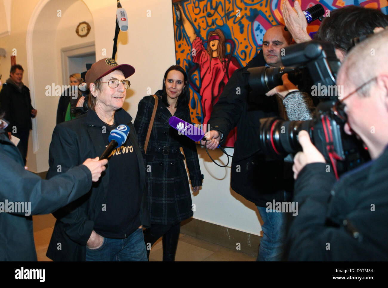 German actor Martin Semmelrogge (L) is surrounded by journalists as he ...