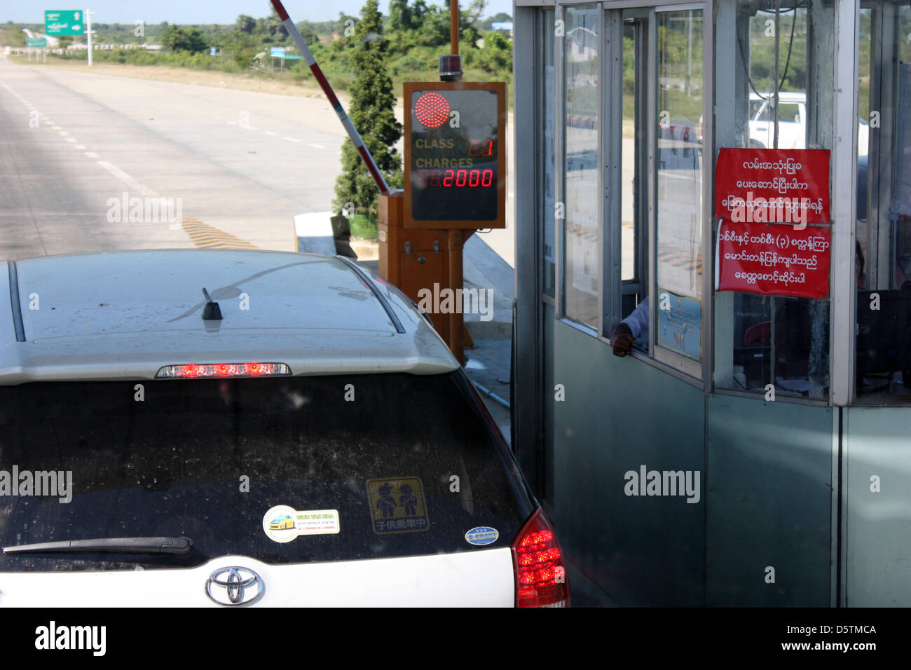 A toll charge is seen on the motorway between Yangon and Mandalay ...
