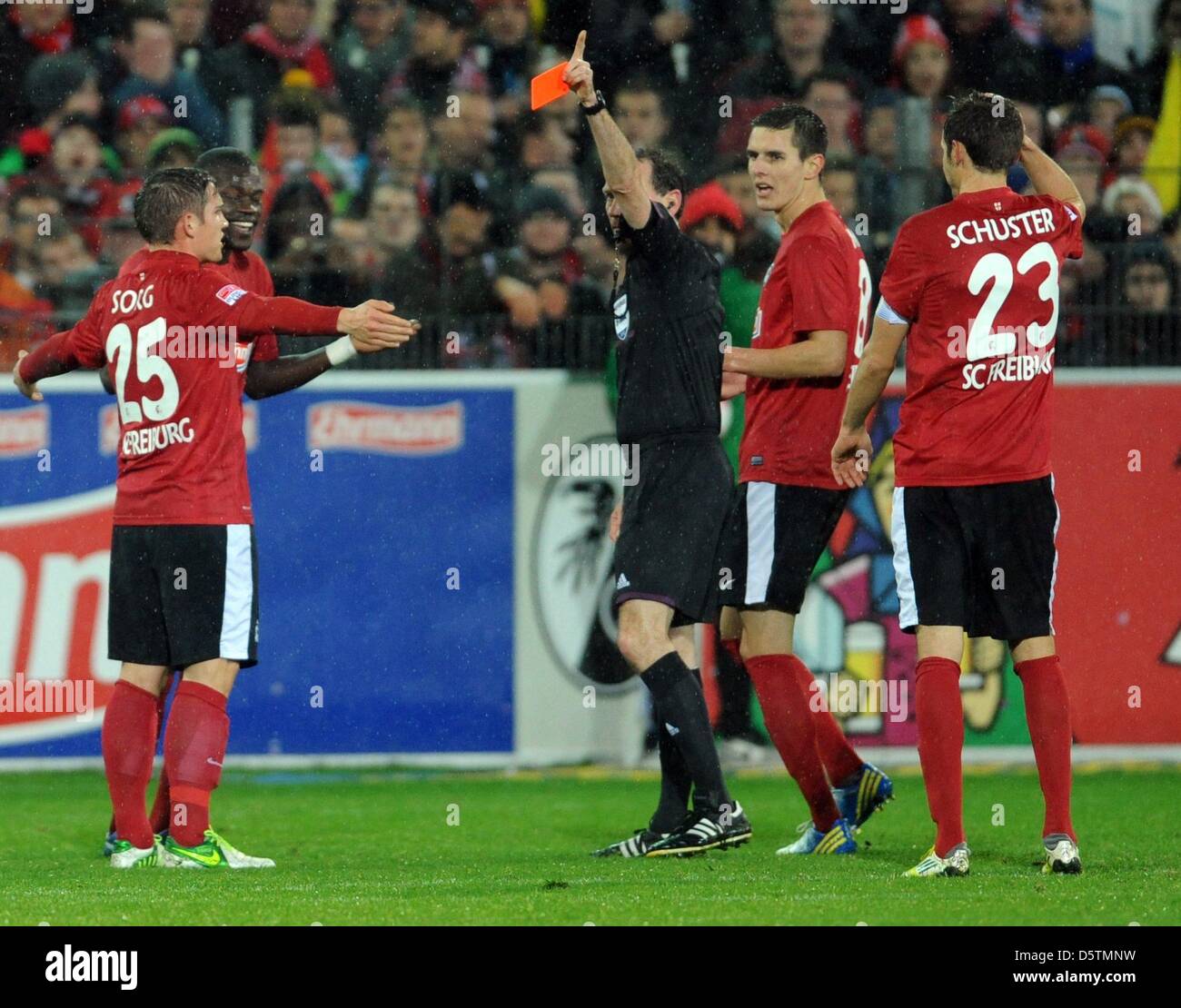 Freiburg's Fallou Diagne (2-L) is shown the red card by referee Florian ...