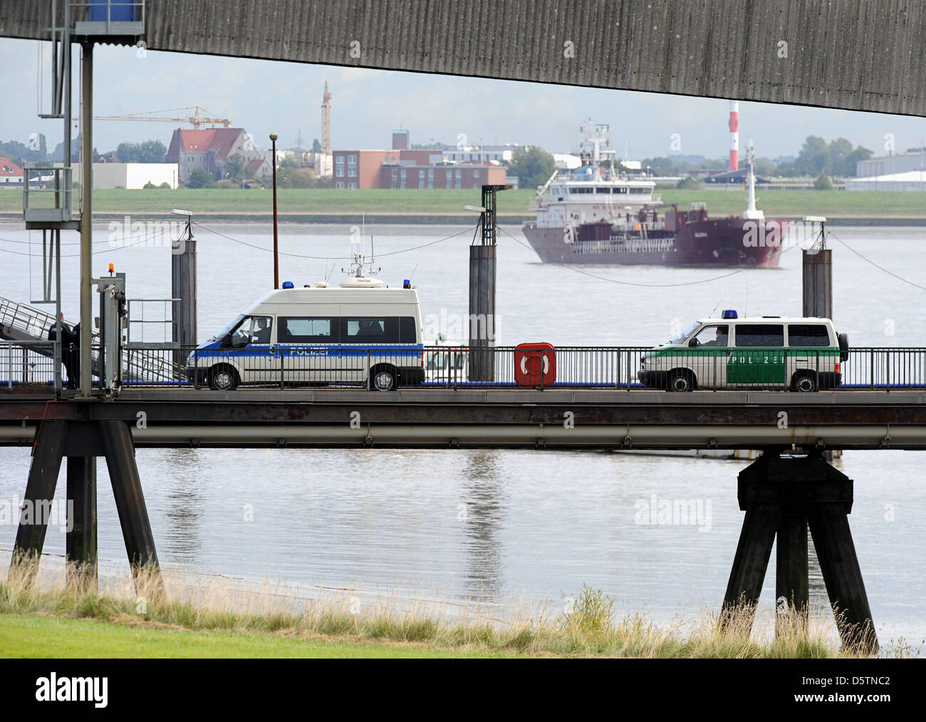 Police officers secure a pier of the RoRo landing pier in Nordenham ...