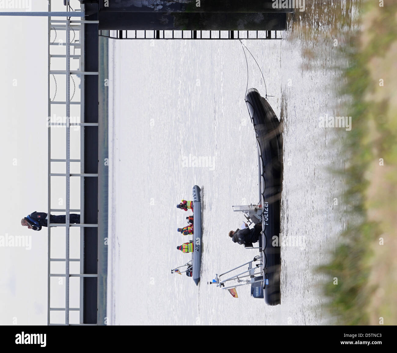 Police officers secure a pier of the RoRo landing pier in Nordenham ...