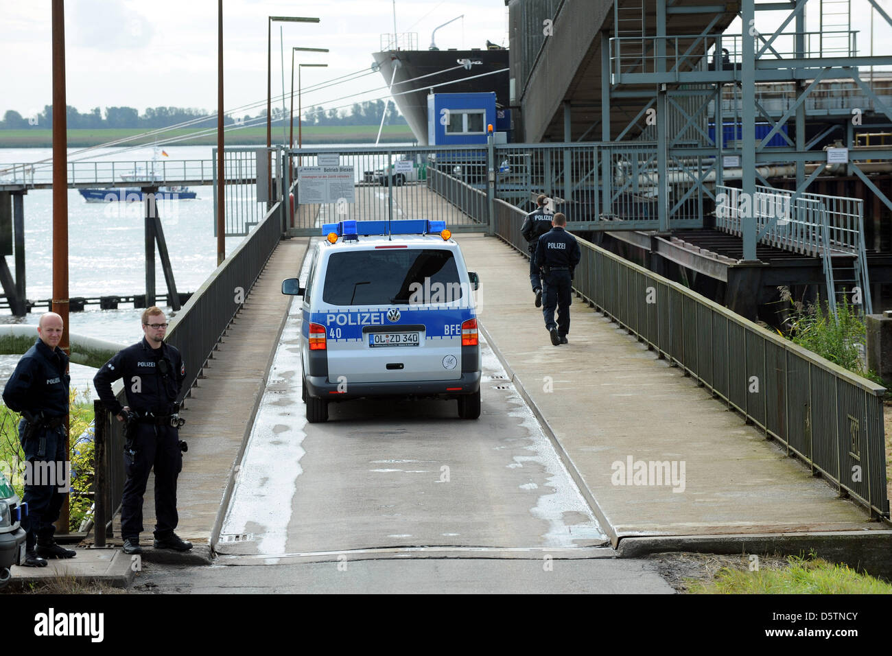 Police officers secure a pier of the RoRo landing pier in Nordenham ...