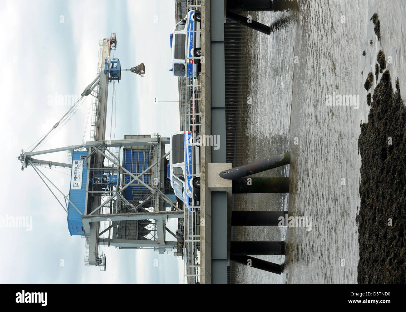 Police officers secure a pier of the RoRo landing pier in Nordenham ...