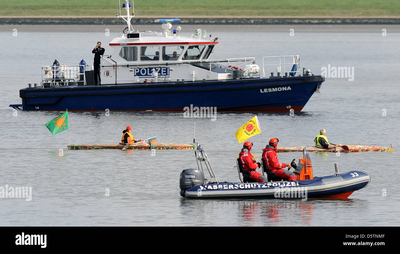 Anti-nuclear activists paddle their boats near the RoRo landing pier in ...