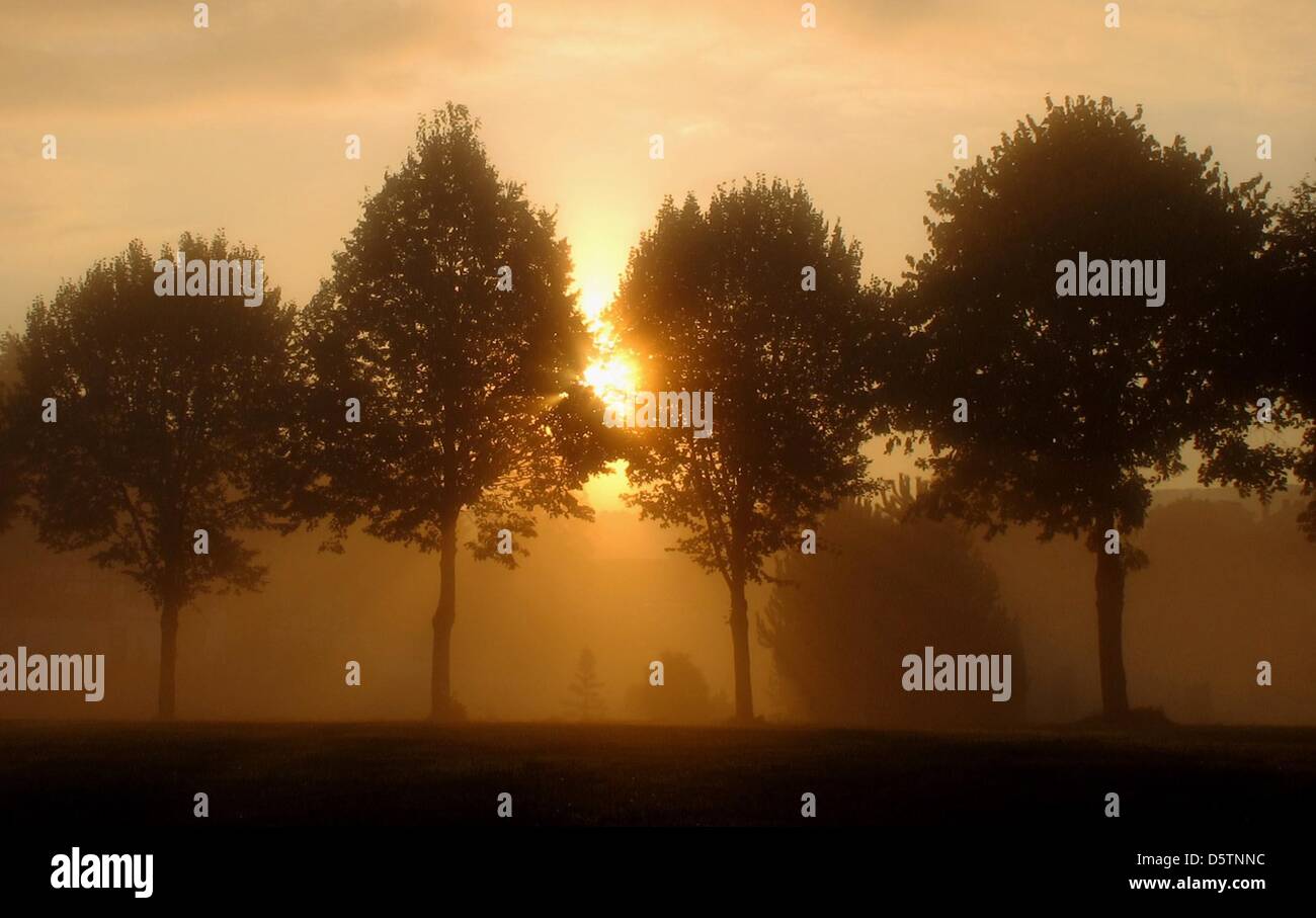 The sun rises behind morning fog in Lippoldsberg, Germany, 22 September ...