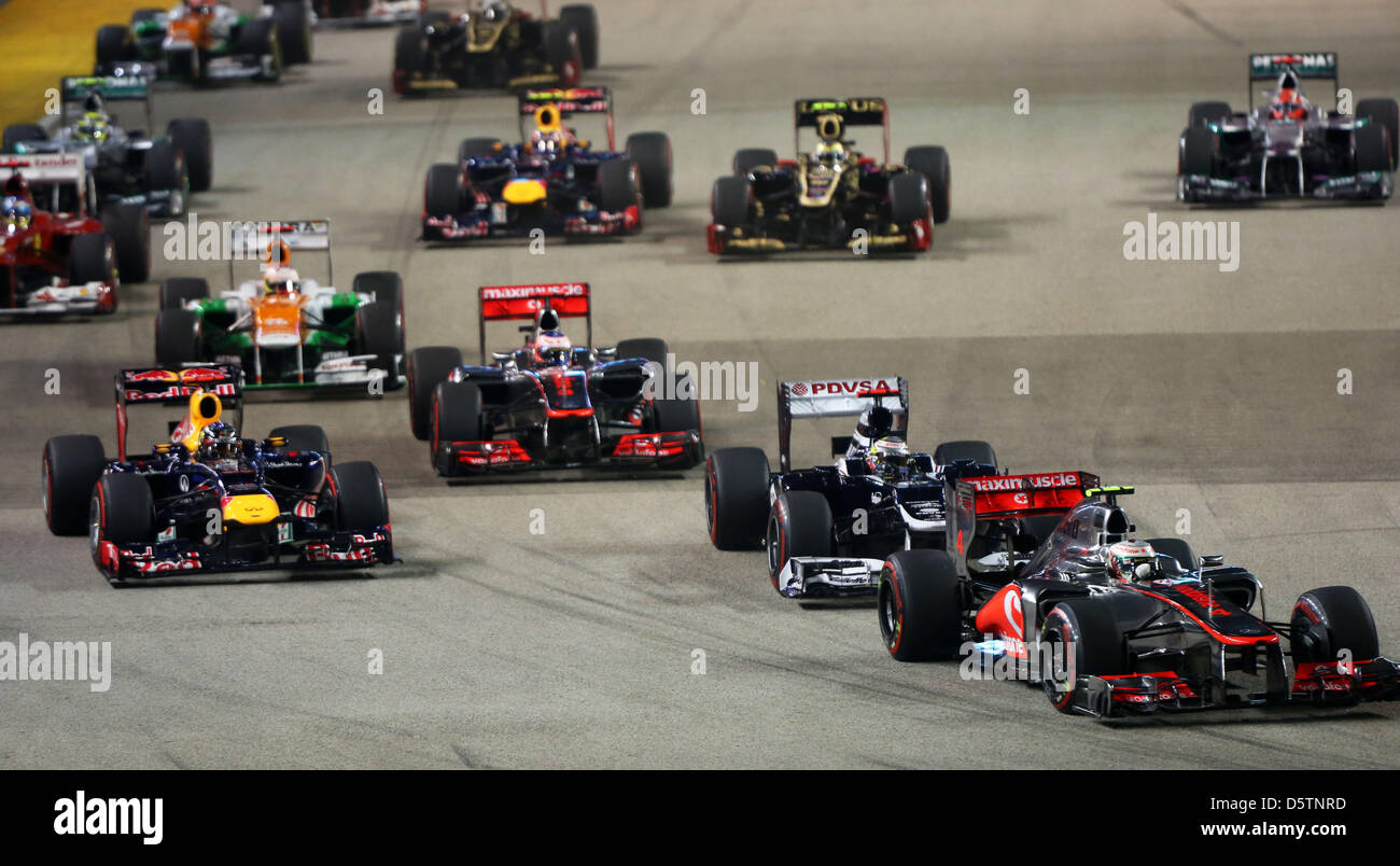 British Formula One driver Lewis Hamilton (R) of McLaren Mercedes leads ...