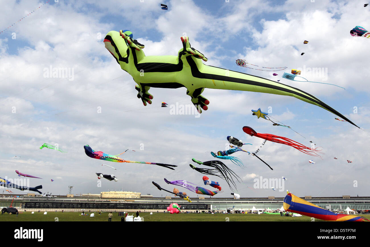 Visitors watch colourful kites at a kite festival on the former ...