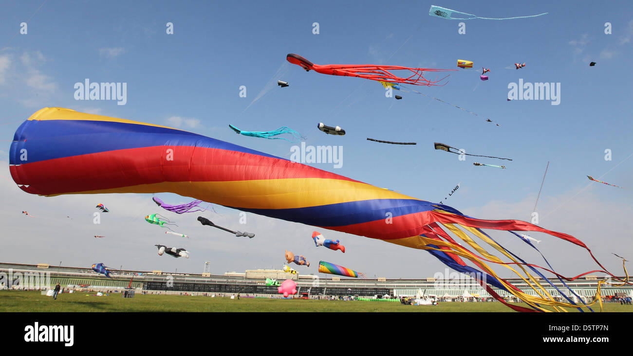 Visitors watch colourful kites at a kite festival on the former ...