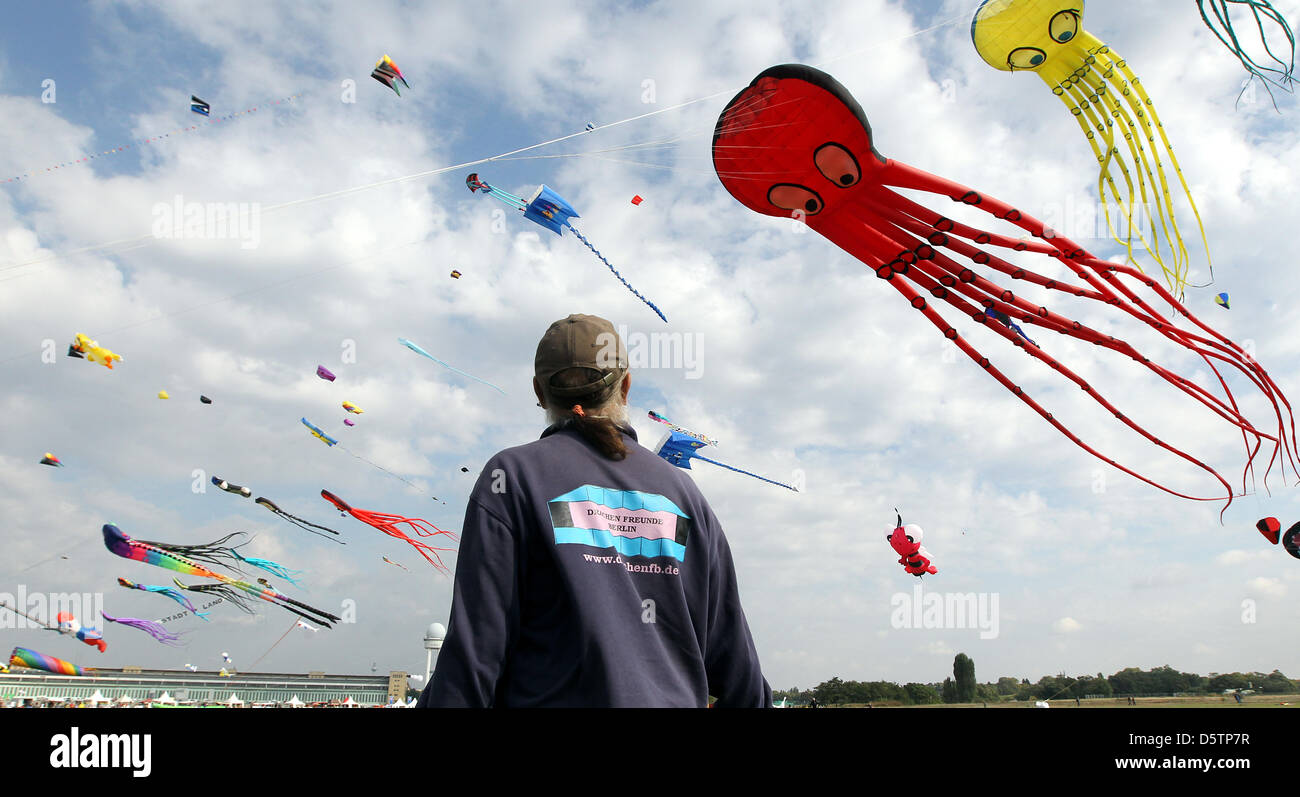 Visitors watch colourful kites at a kite festival on the former ...