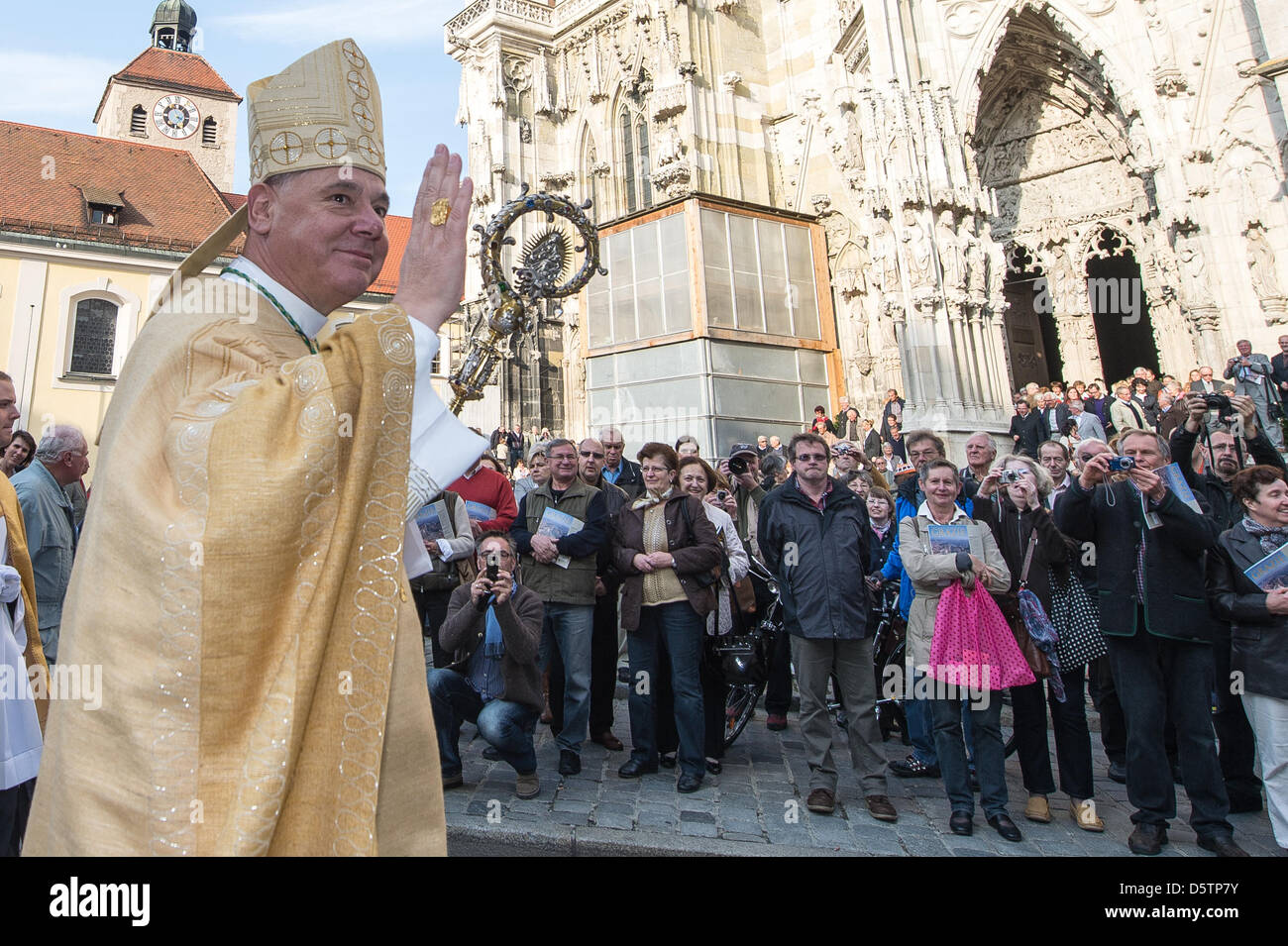 Arch bishop Gerhard Ludwig Mueller waves to the crowd in front of the ...