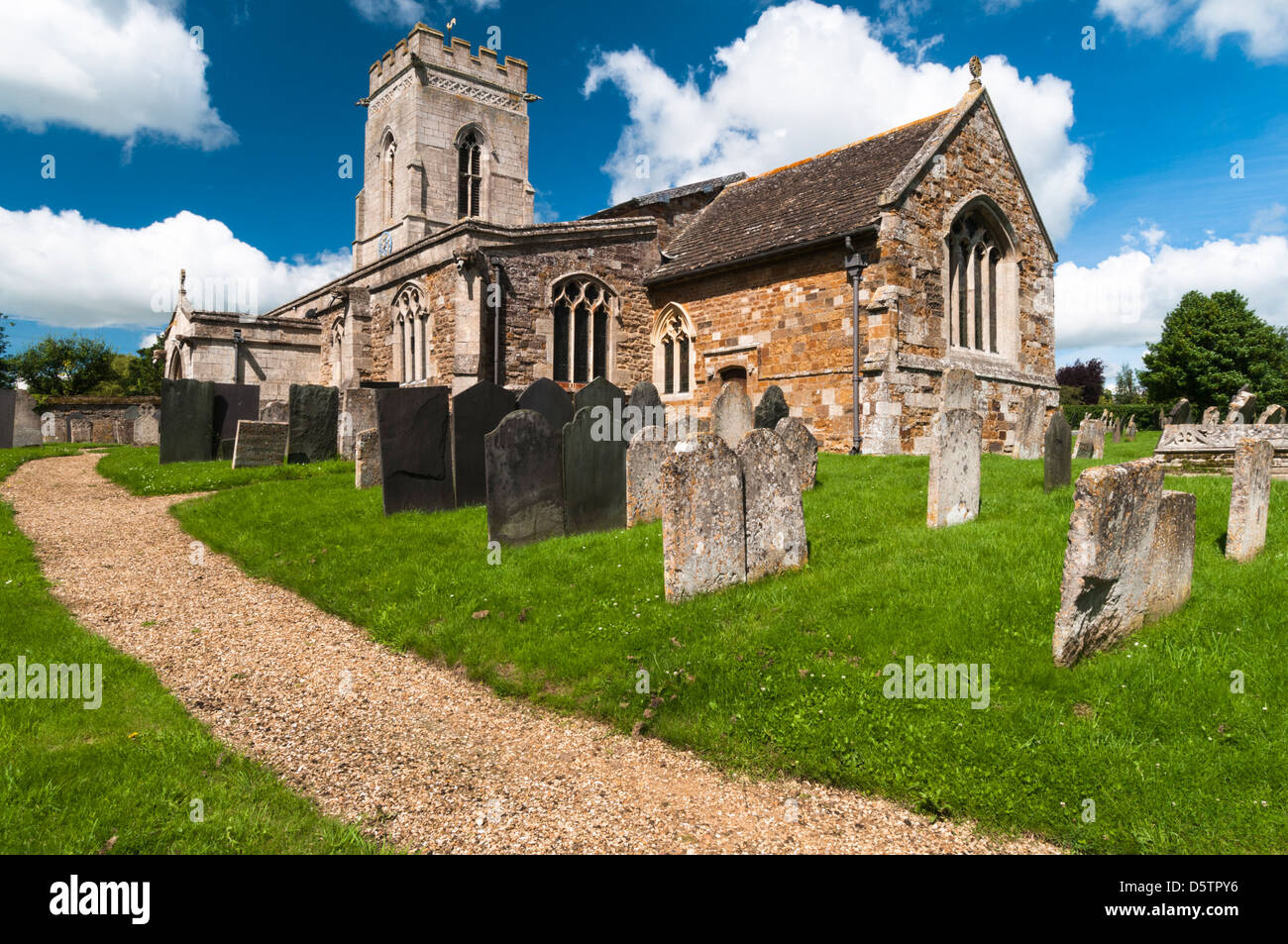 The church of St Peter and churchyard in the picturesque village of ...