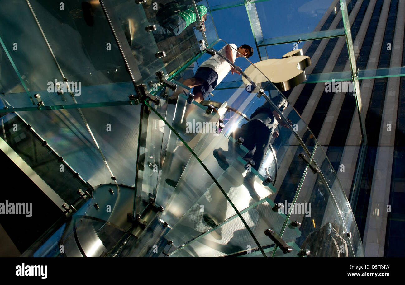 Customers enter the Apple Store via a staircase on 5th Avenue in New ...