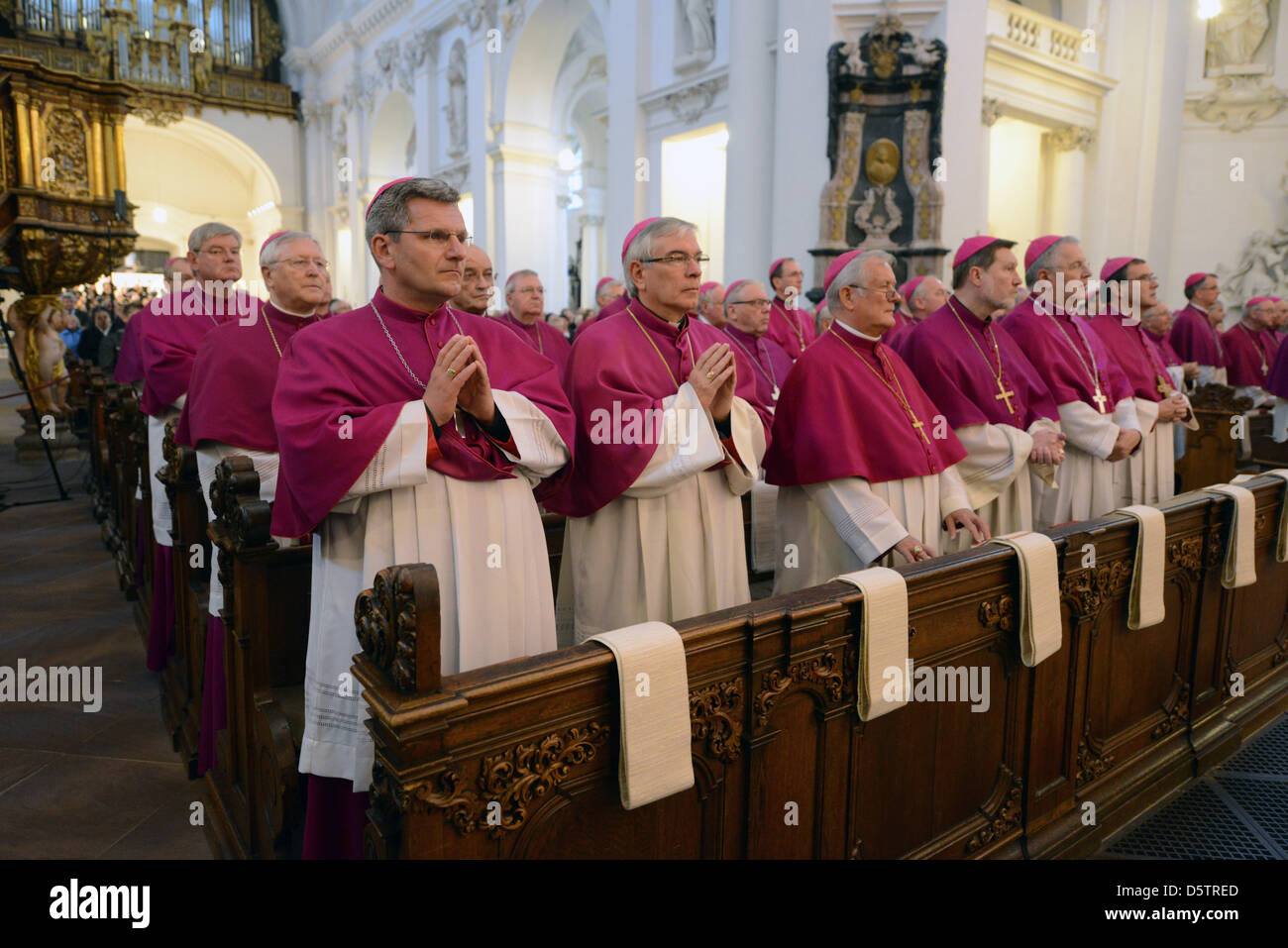 Members the German Bishops' Conference pray during the opening service ...