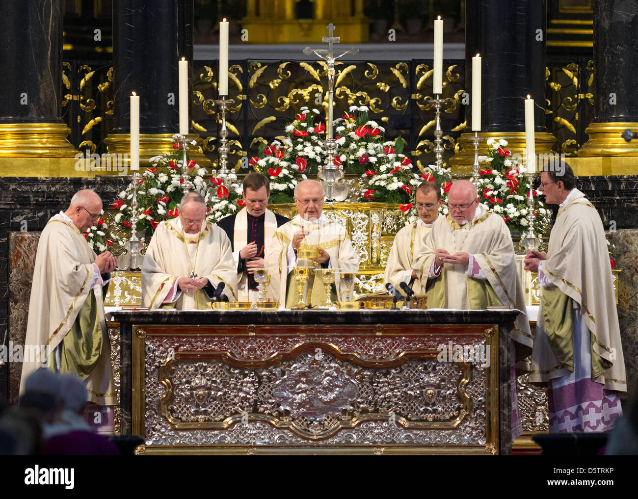 Members the German Bishops' Conference celebrate the Eucharist during ...