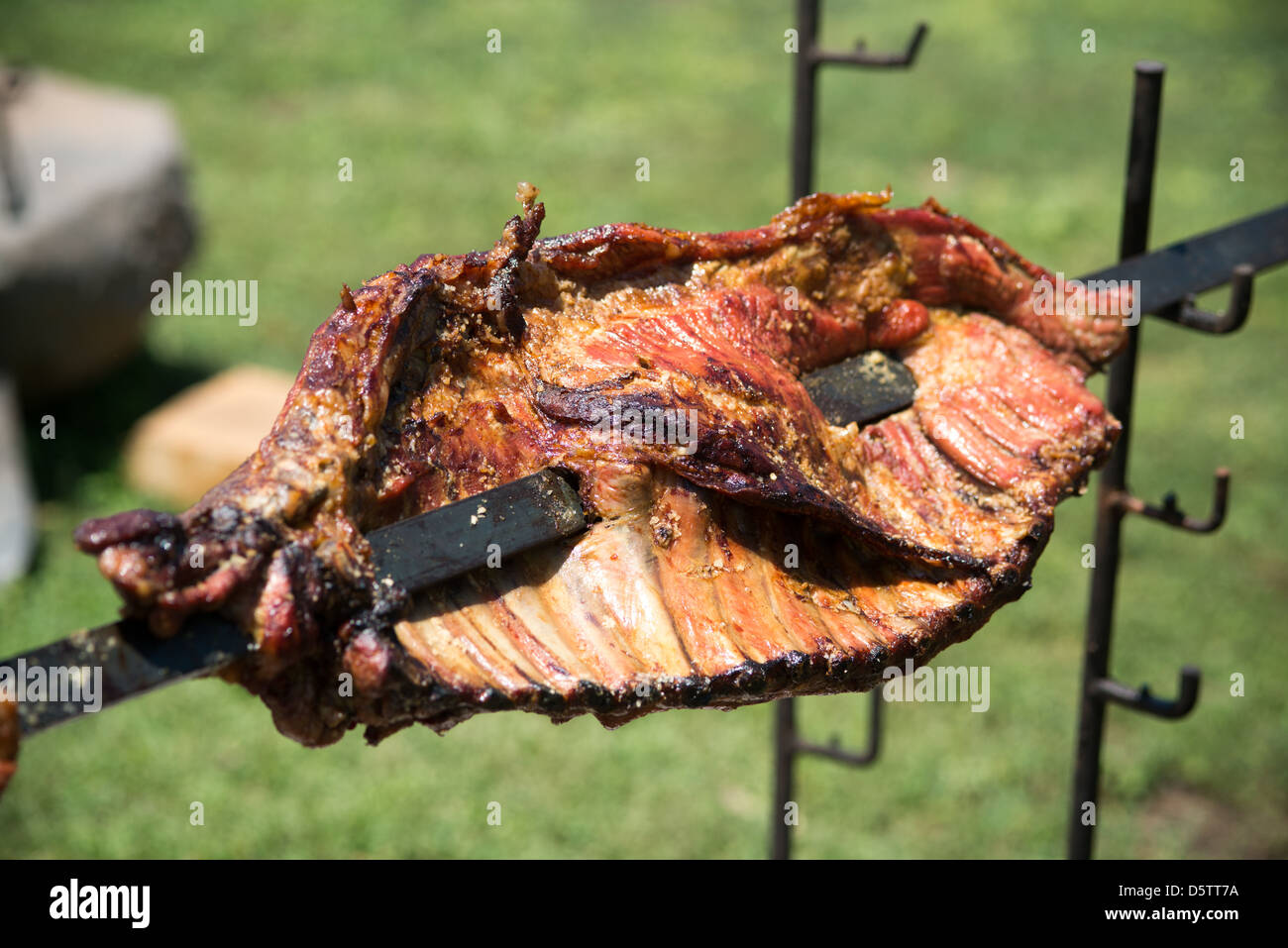 Roasting pig on a spit on a farm in Rancagua, Chile Stock Photo - Alamy