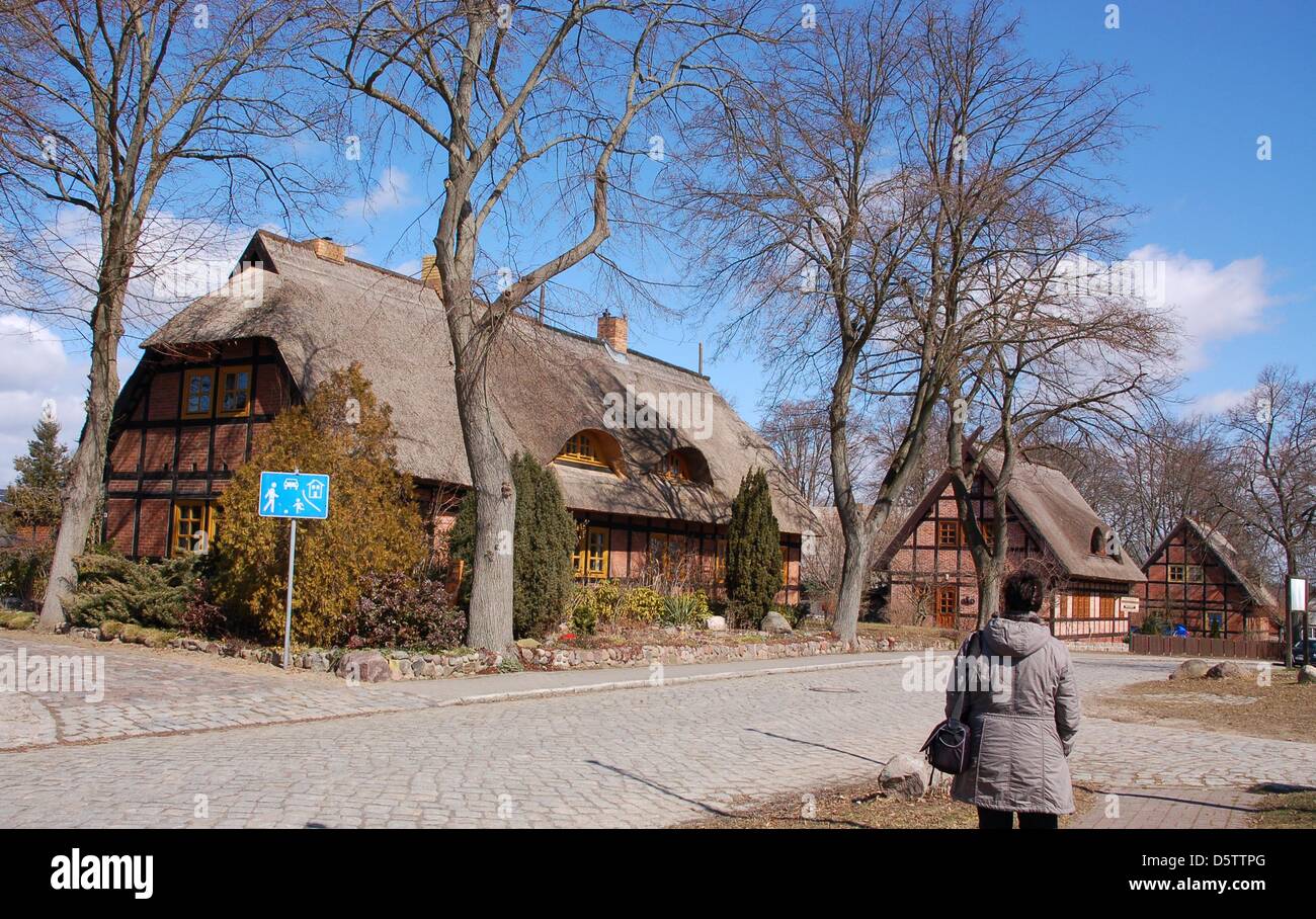 The typical timber frame buildings with thatched rooves are pictured in ...