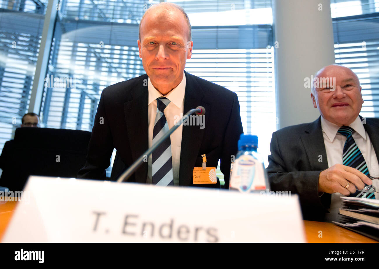 CEO of EADS, Tom Enders (L), takes his seat next to chairman of the ...