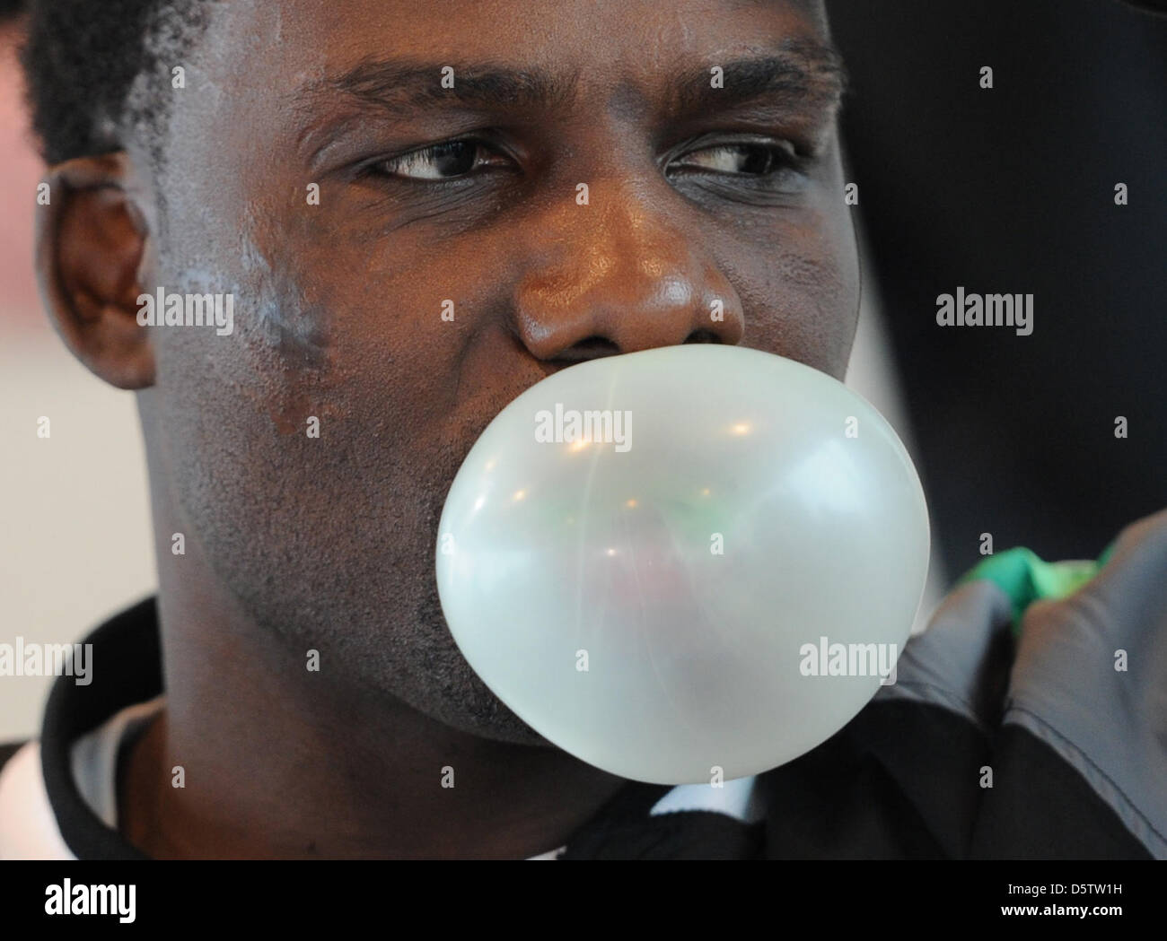 US heavy weight boxer Hasim Rahman makes a bubble gum bubble before the ...