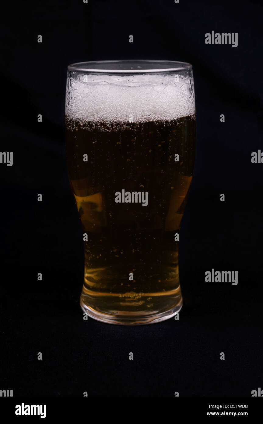Beer Glass isolated on a black background Stock Photo - Alamy