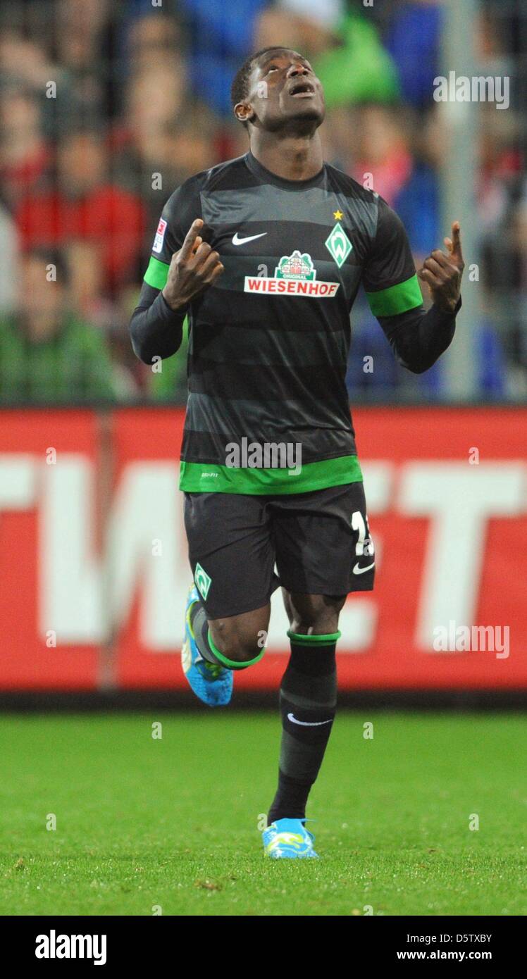 Bremen's Joseph Akpala runs across the picth and cheers after scoring ...