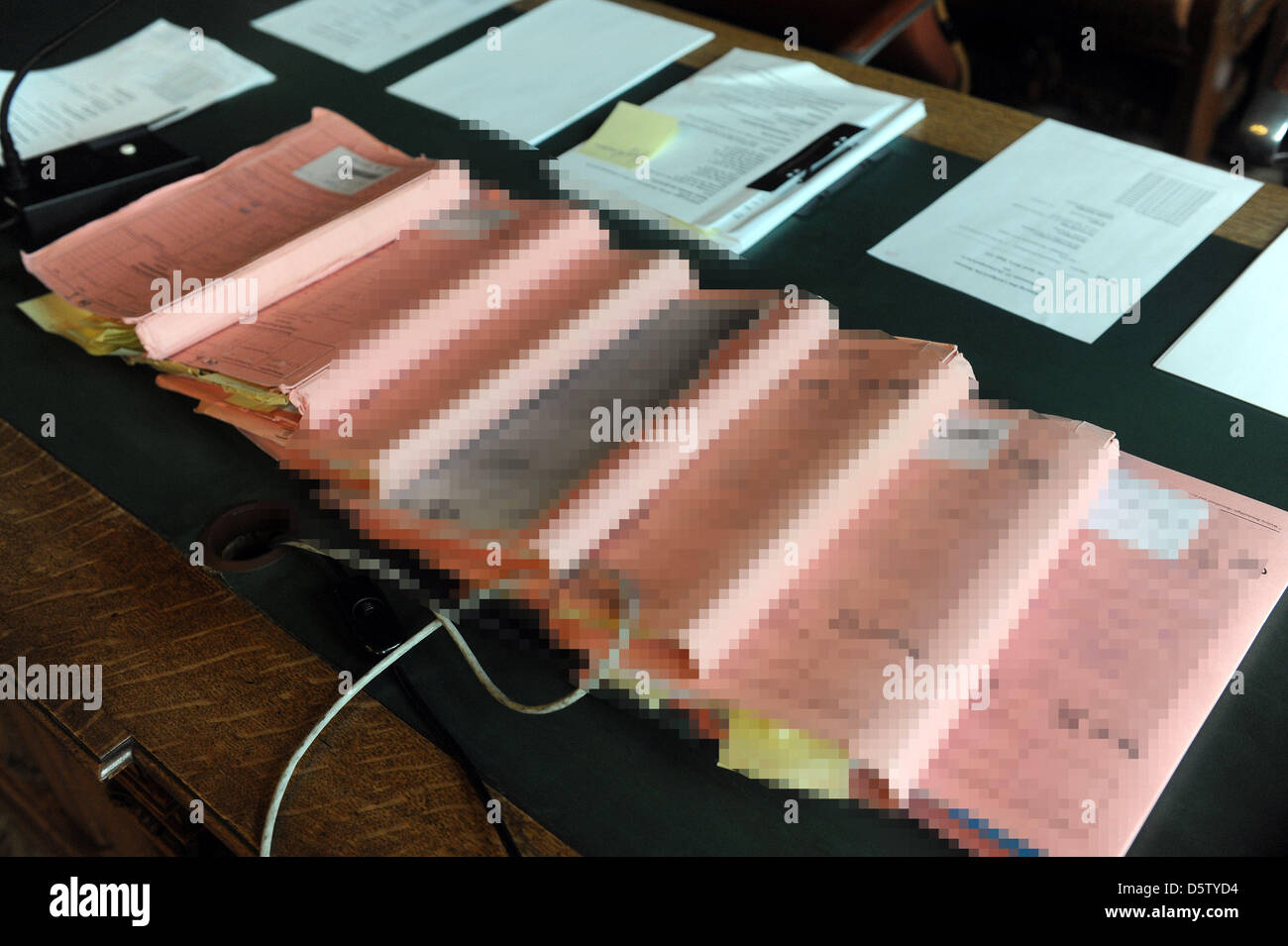 Case-files sit on the judge's desk at the regional court in Bremen ...