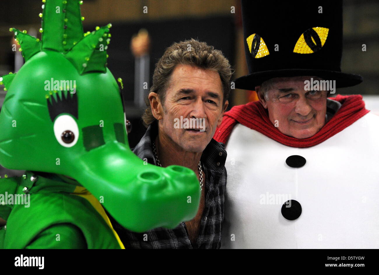 Singer and composer Peter Maffay (m) poses with Tabaluga enactor and ...