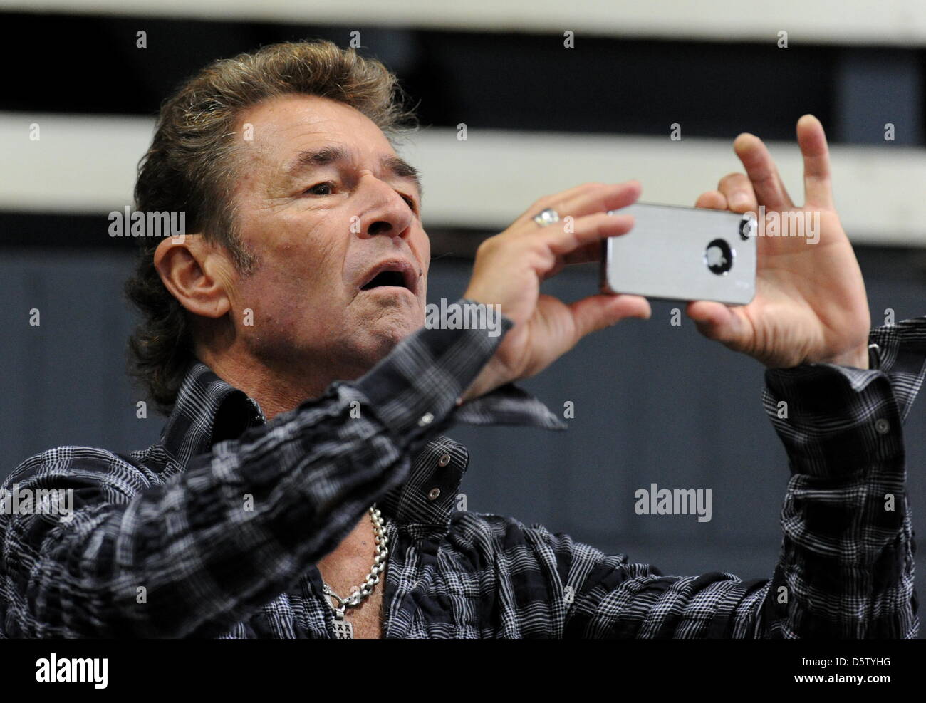 Singer and composer Peter Maffay takes pictures during rehearsals for ...