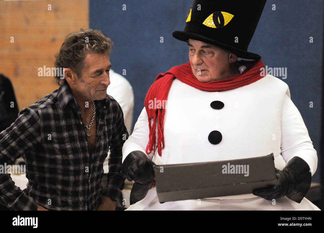 Singer and composer Peter Maffay (m) poses with Heinz Hoenig (r) as ...