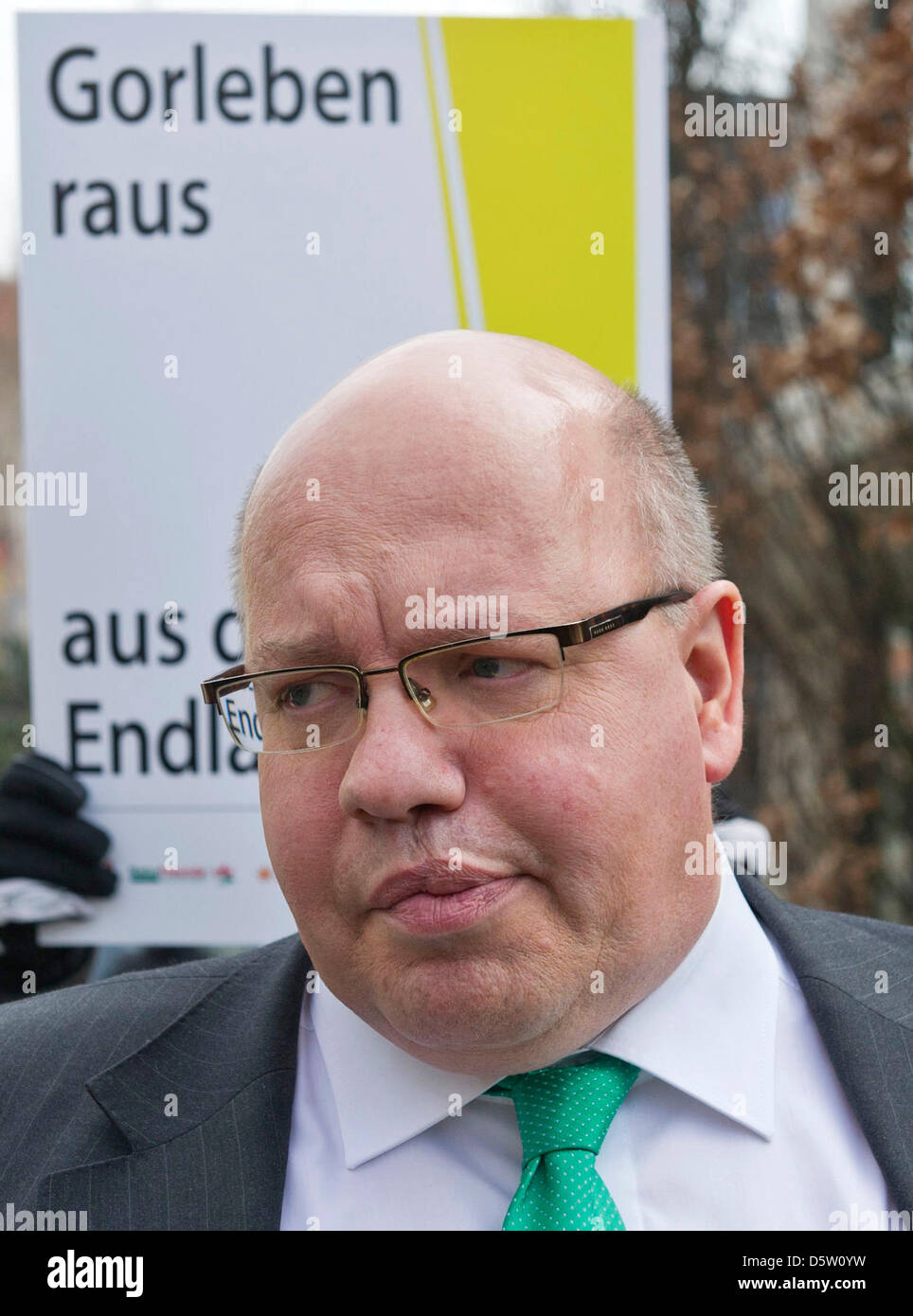 German Federal Environment Minister Peter Altmaier walks past anti ...