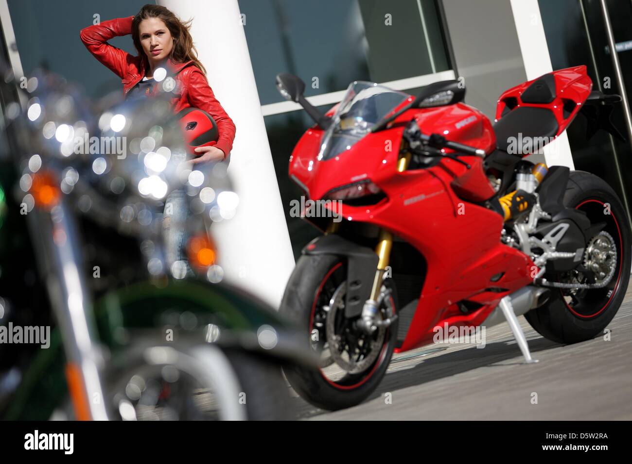 Model Anne poses nect to a Ducati Panigale S during a photocall for the ...