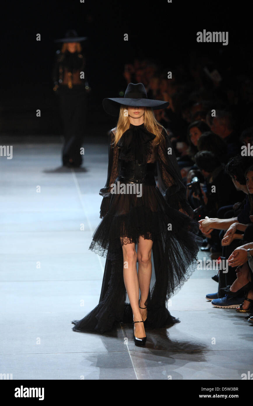 A model wears a creation by French designer Hedi Slimane as part of the ...