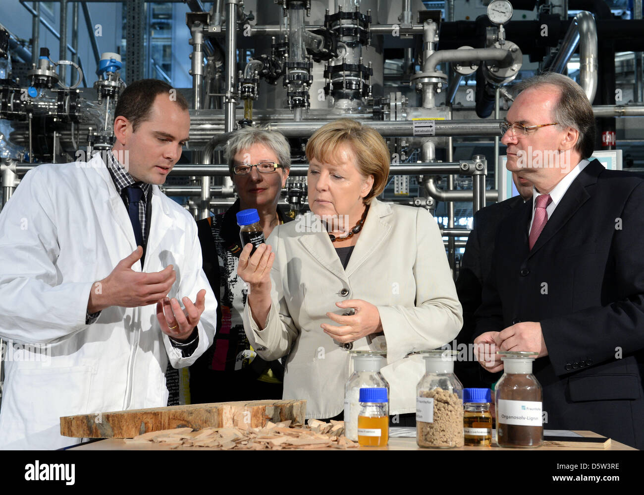 Timber merchant Moritz Leschinsky (L) explains the production process ...