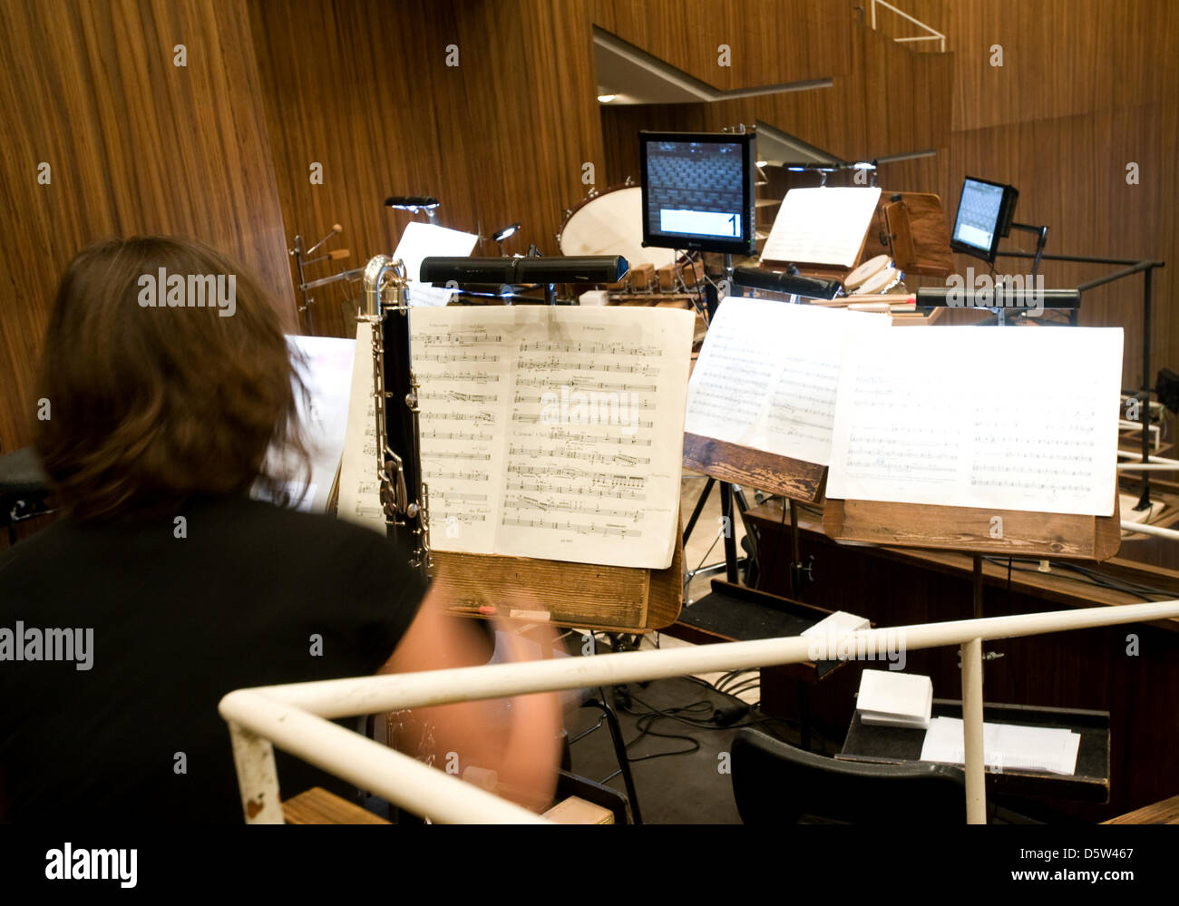 A musician during the rehearsals in the auditorium of Deutsche Oper ...