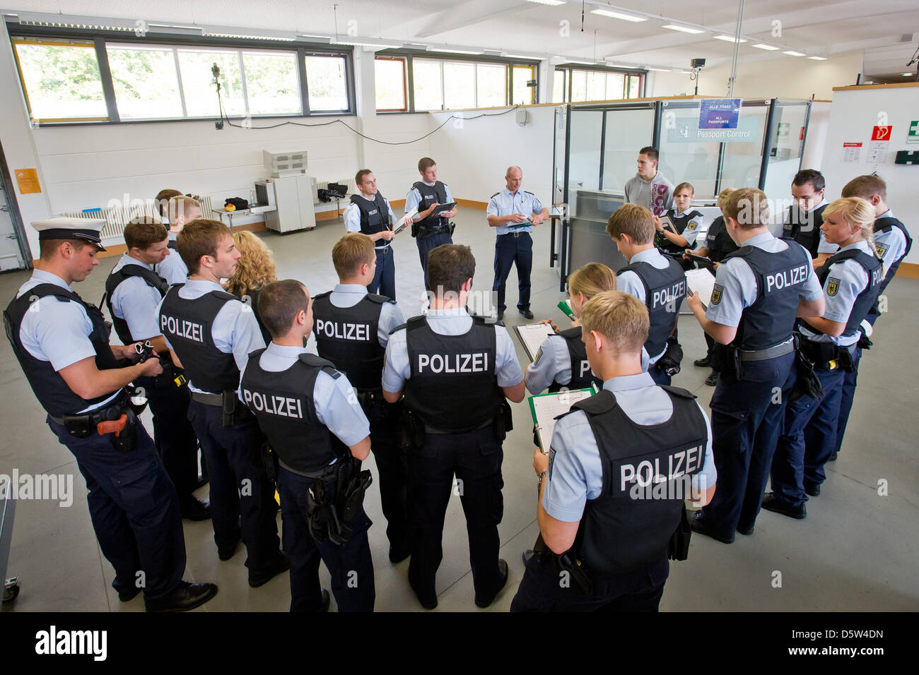 Police officer trainees discuss a scenario from the daily life of a ...
