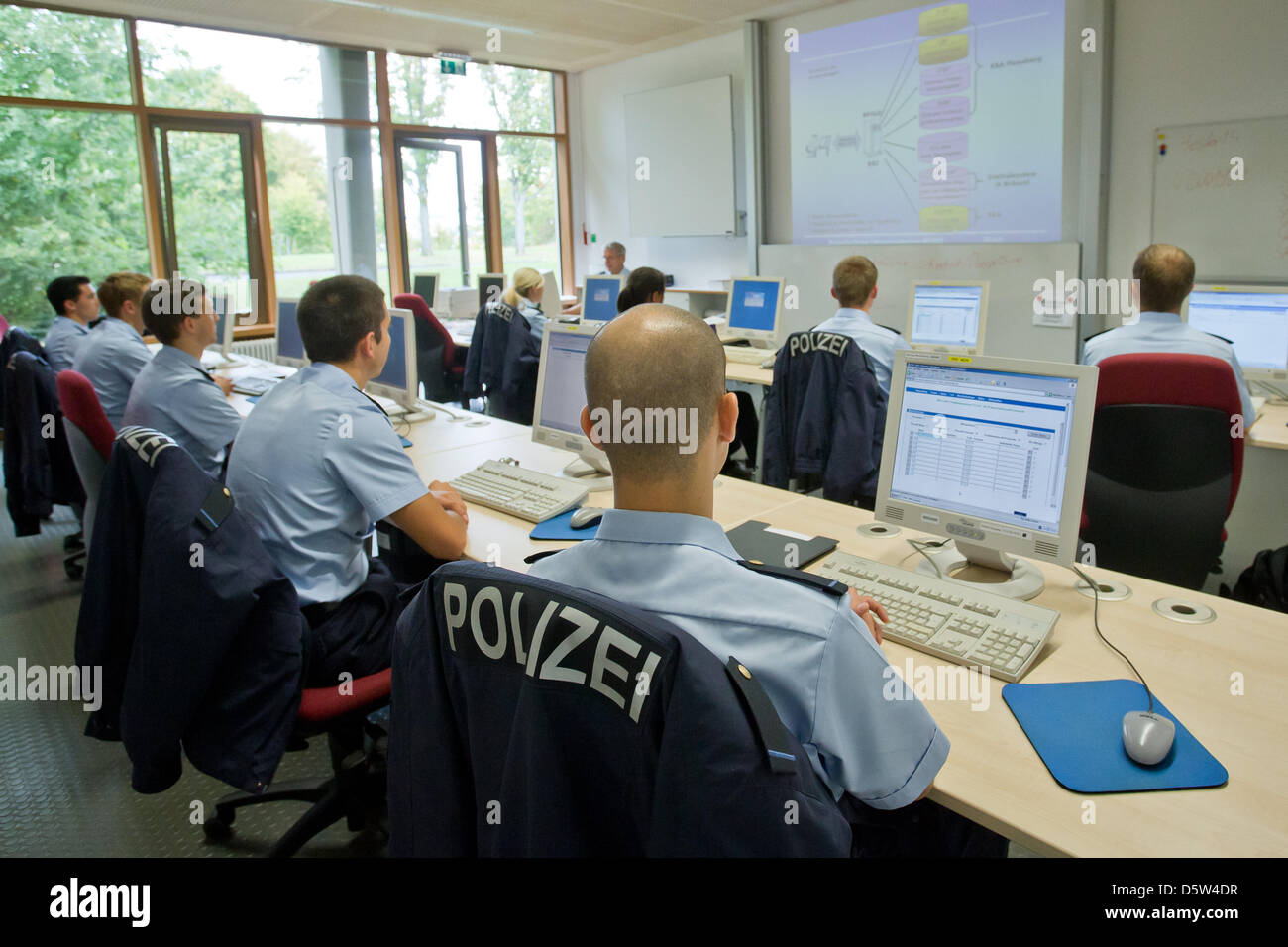 Police officer trainees take part in a class at the training and ...