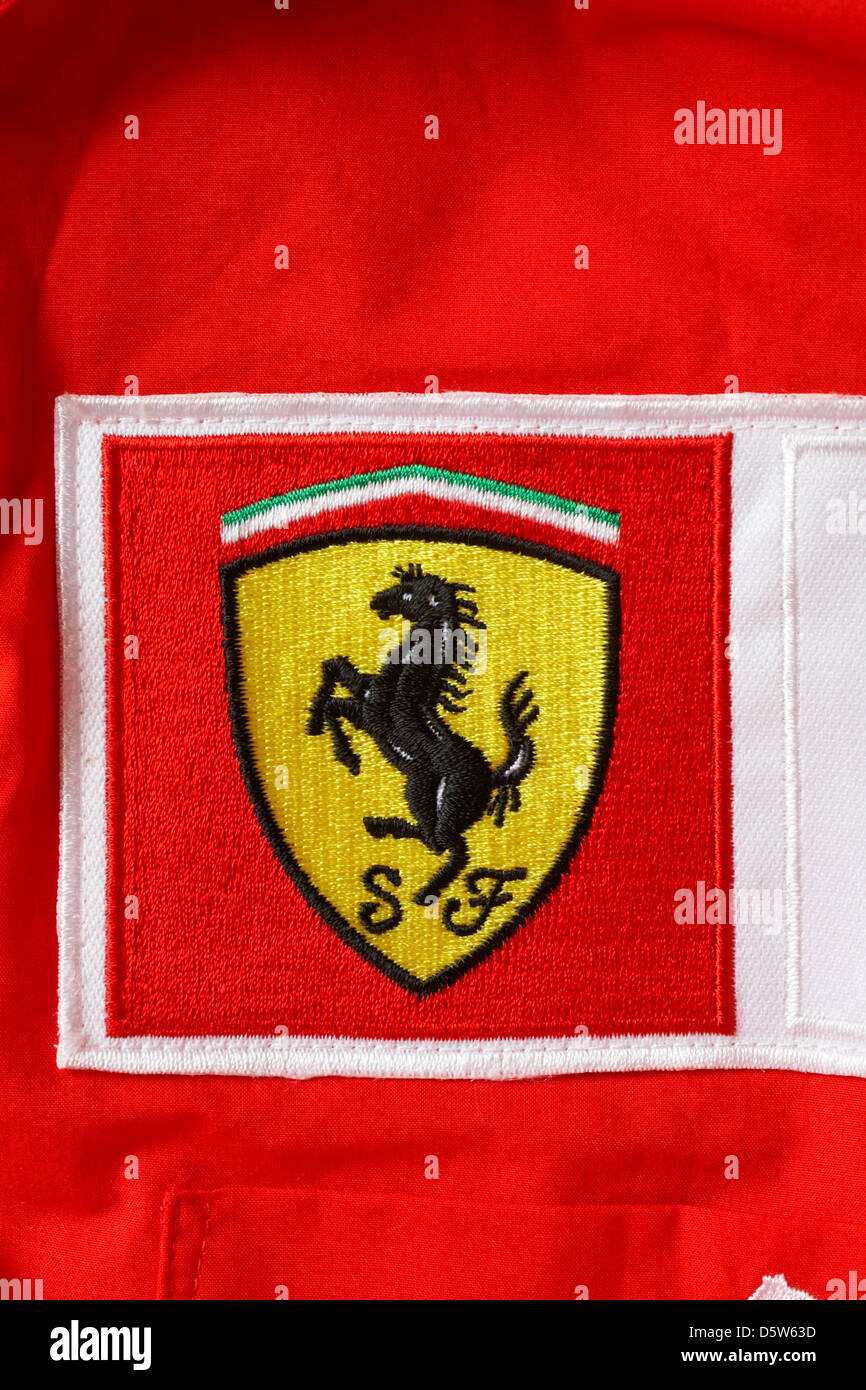 Scuderia Ferrari racing shield logo on red top Stock Photo - Alamy
