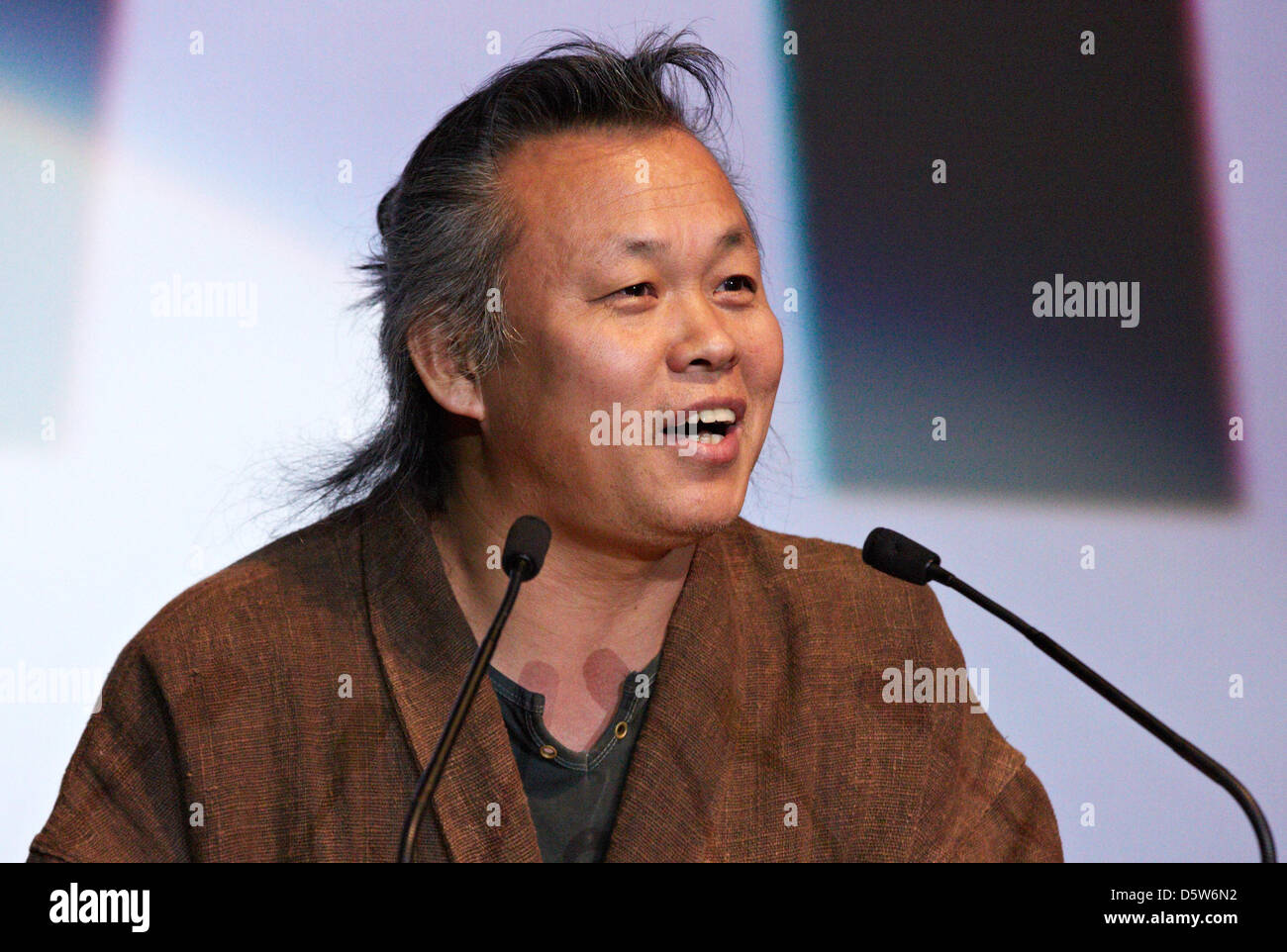 South Korean director Kim Ki-duk sings a song after he received the ...