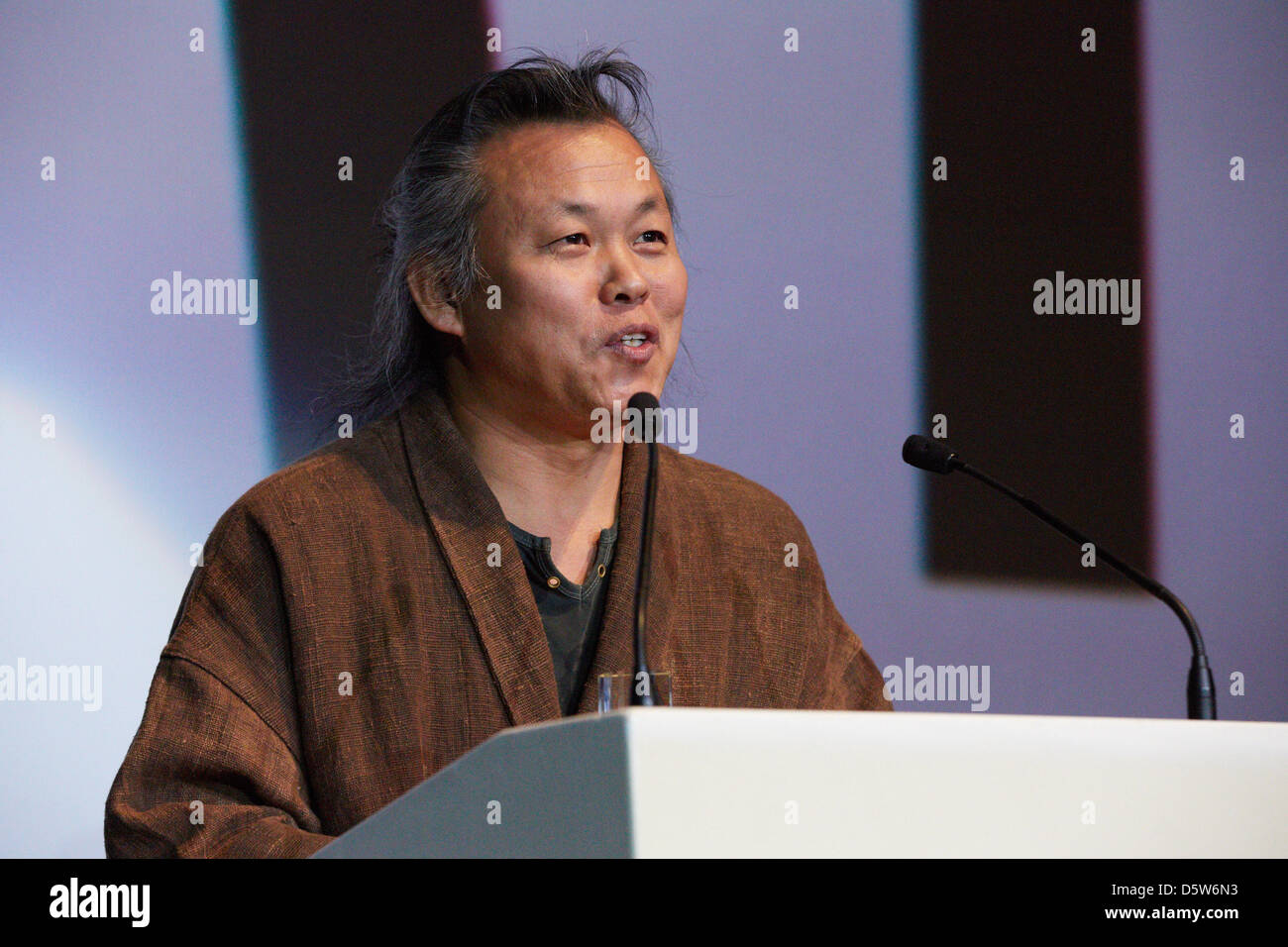 South Korean director Kim Ki-duk delivers a speech after he received ...
