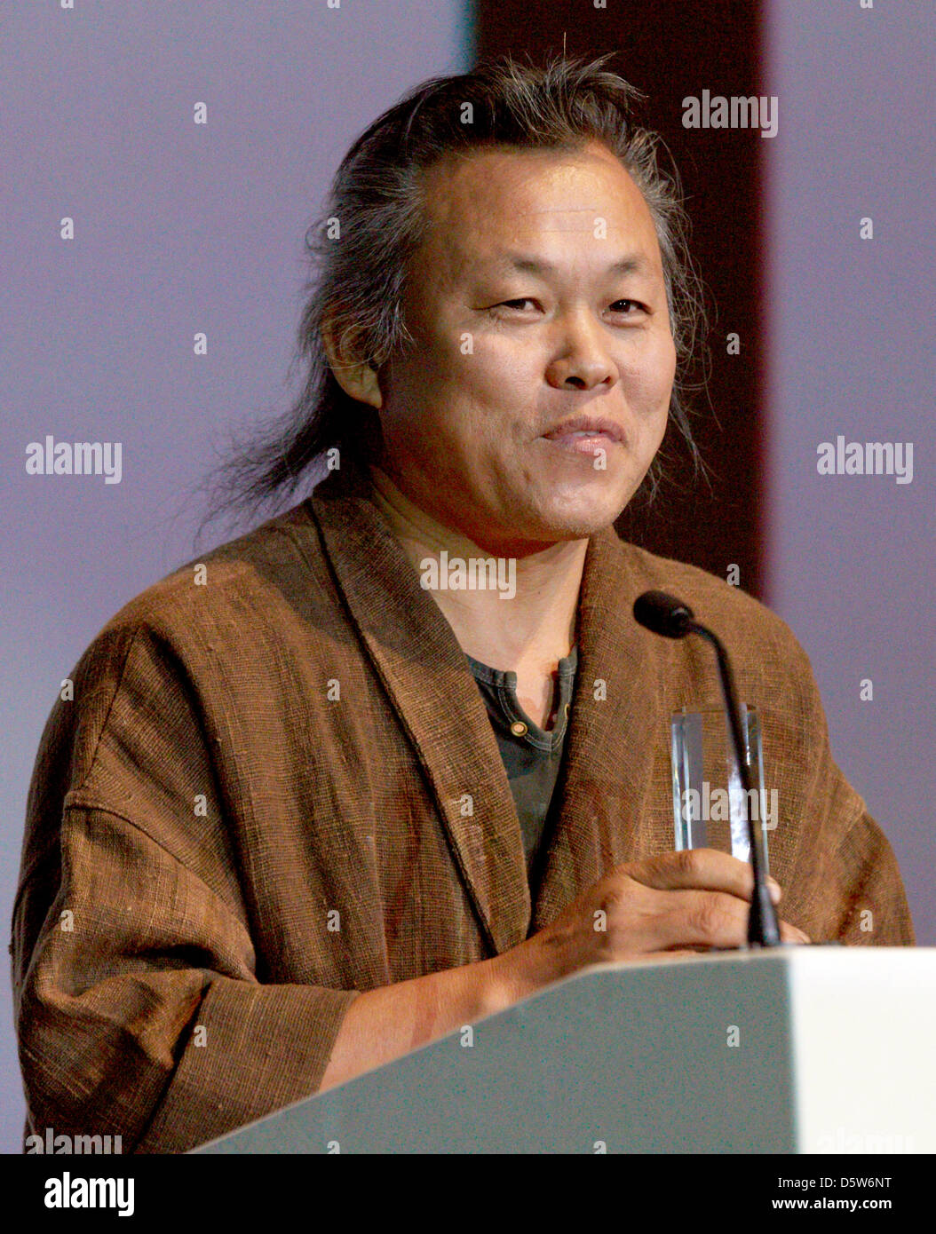 South Korean director Kim Ki-duk delivers a speech after he received ...