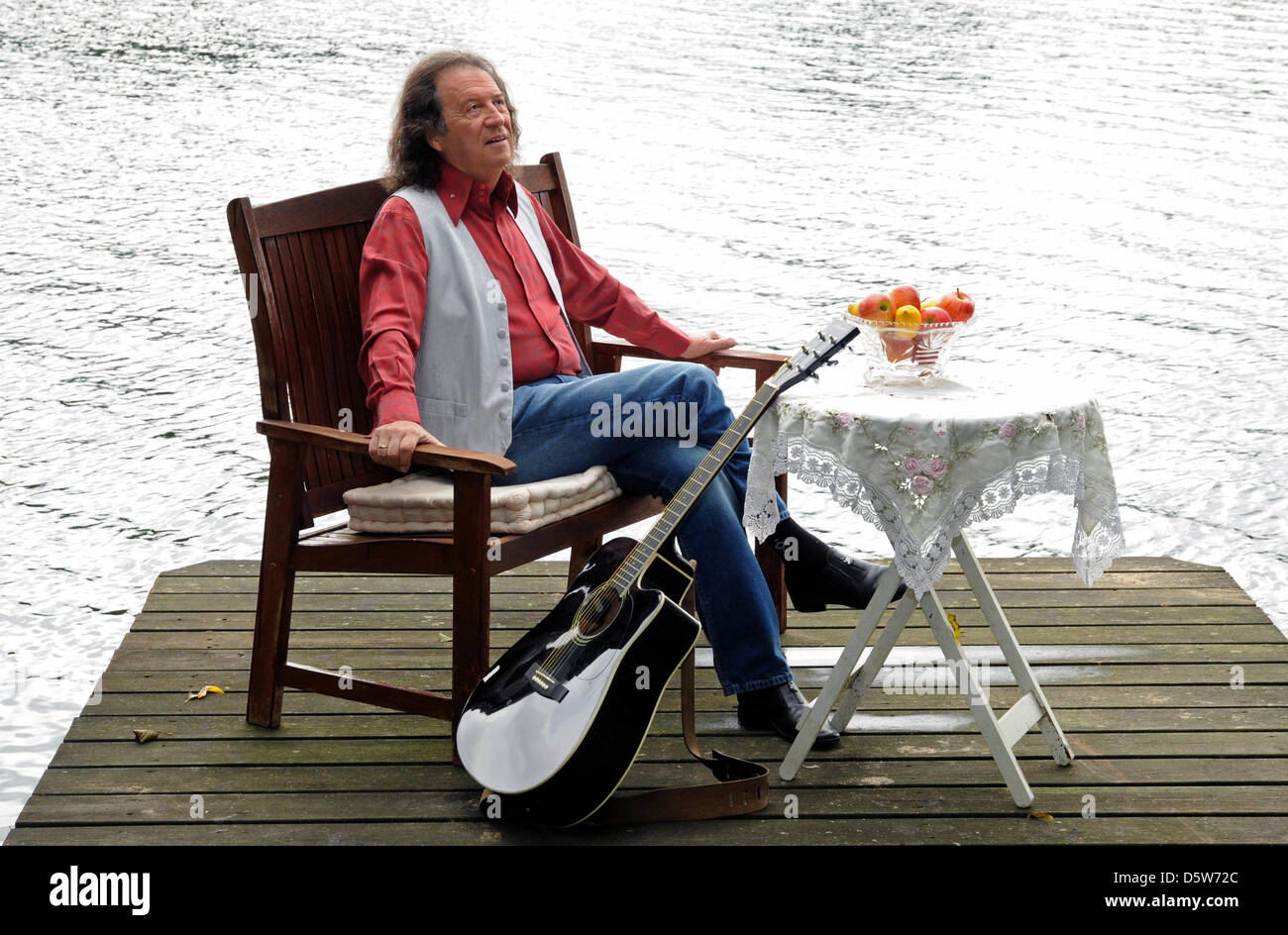 EXCLUSIVE: British pop singer Chris Andrews poses with his guitar on a ...