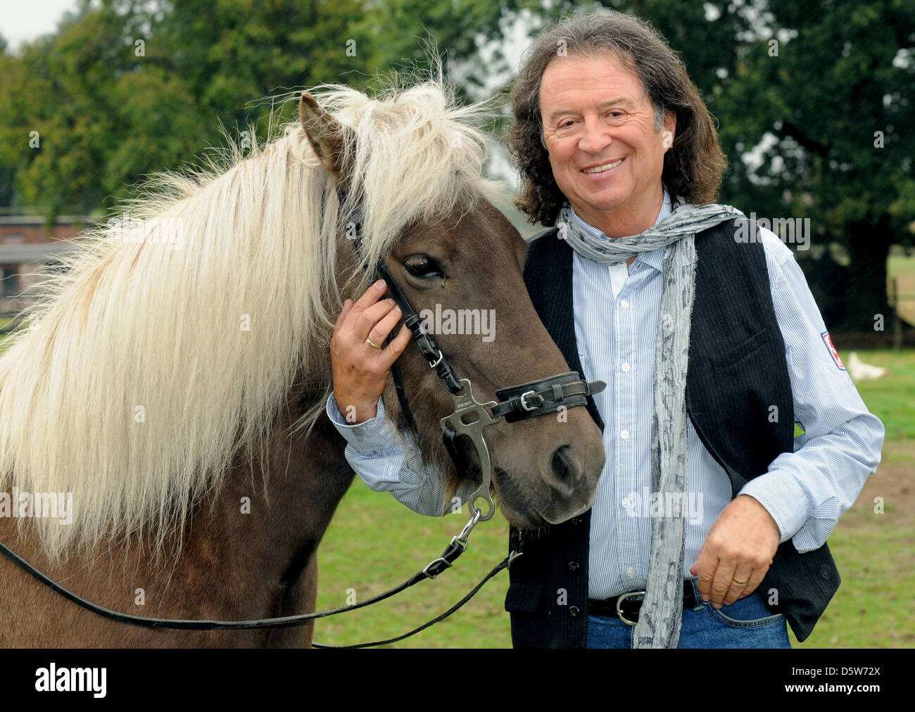 EXCLUSIVE: British pop singer Chris Andrews and his wife Alexandra pose ...