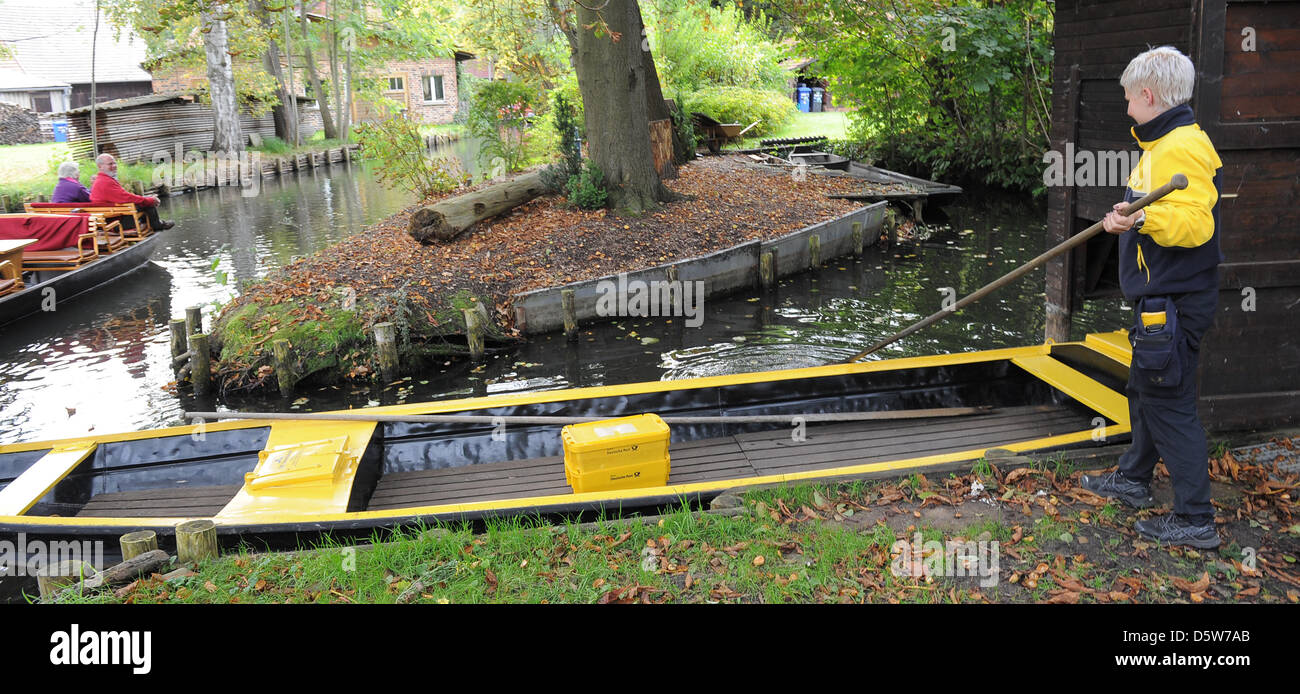 Boat post woman Andrea Bunar puts the post boat in the boathouse after ...