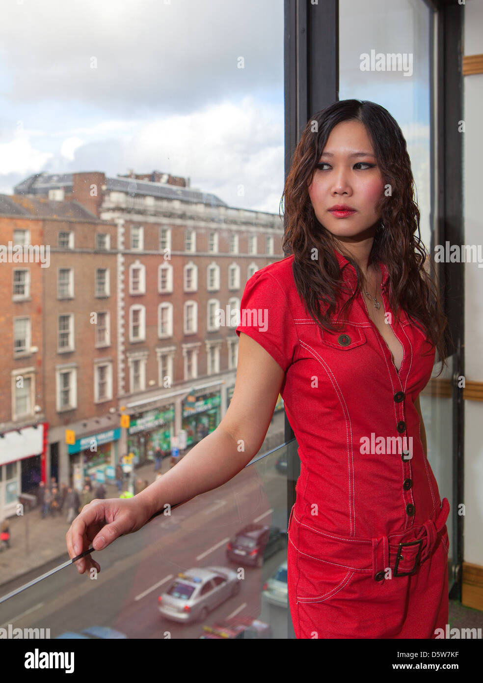 A Thai female model posing beside a window in Dublin, Ireland Stock ...