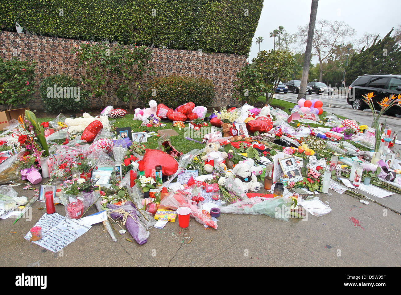 Fans pay tribute to Whitney Houston outside the Beverly Hilton Hotel in ...