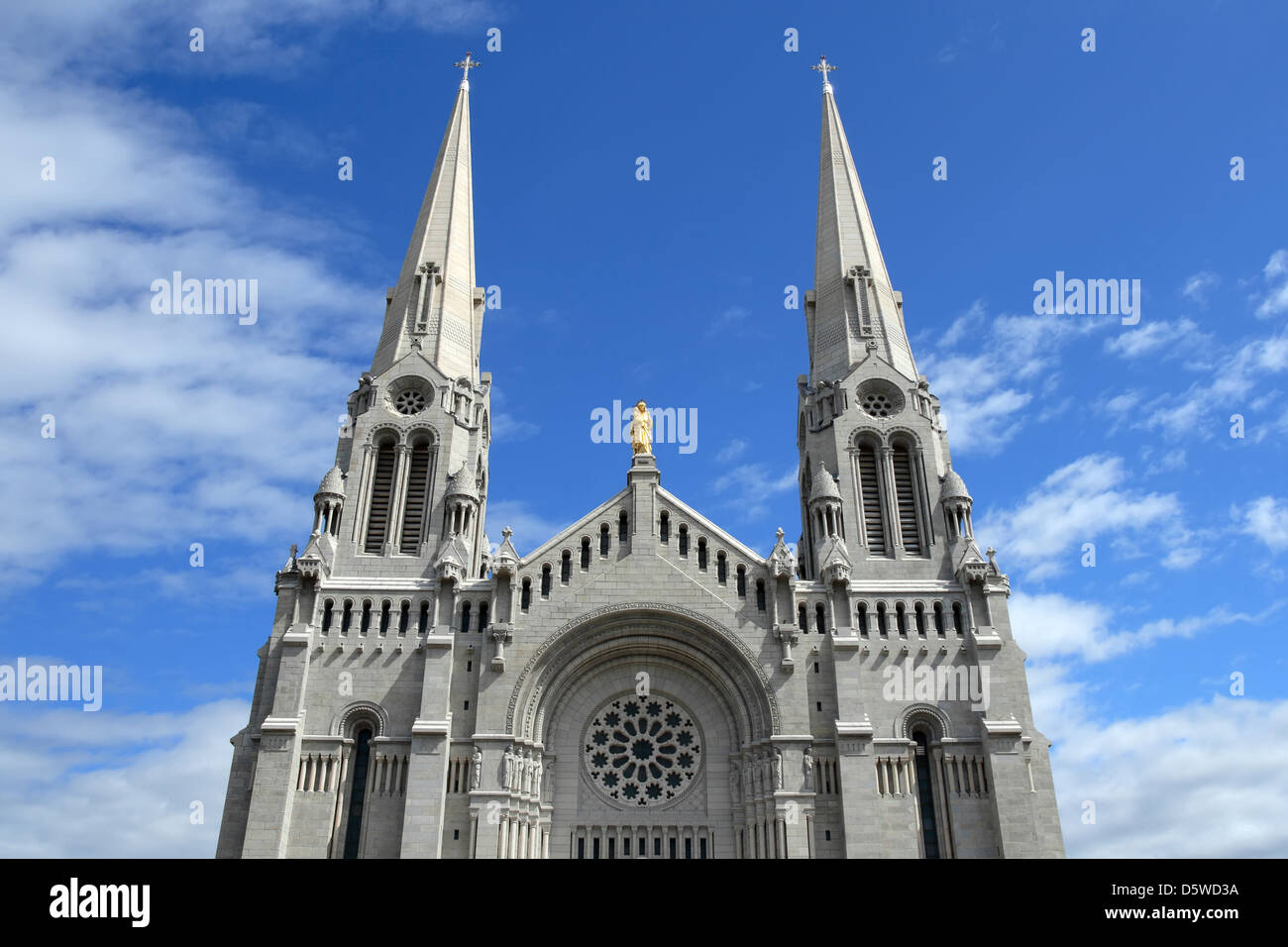 Catholic church against blue sky with clouds Stock Photo - Alamy