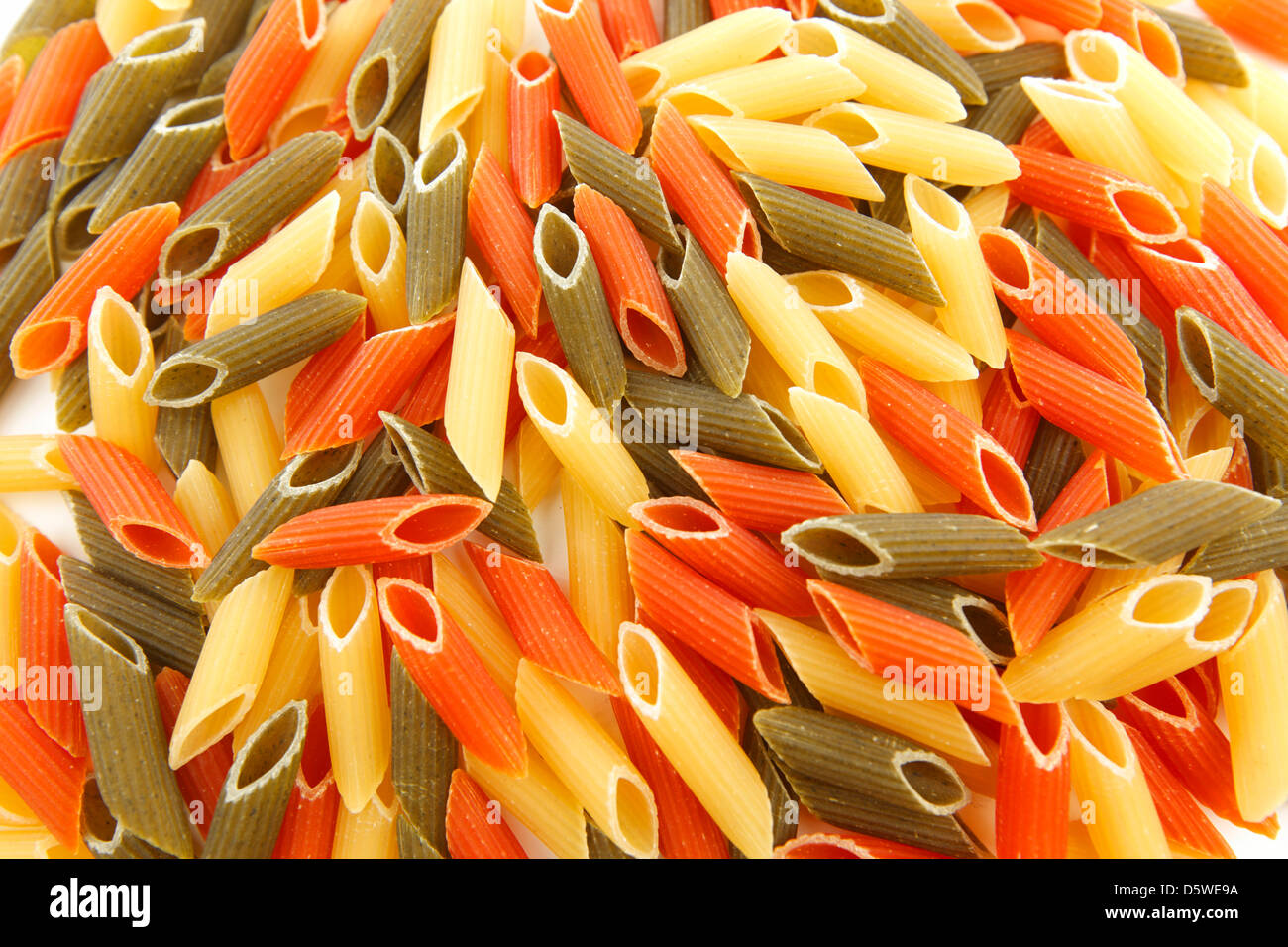 Colored dry italian pasta background Stock Photo - Alamy